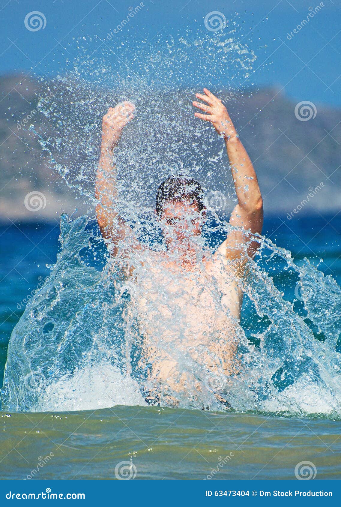 Man splashing water. stock photo. Image of human, active - 63473404