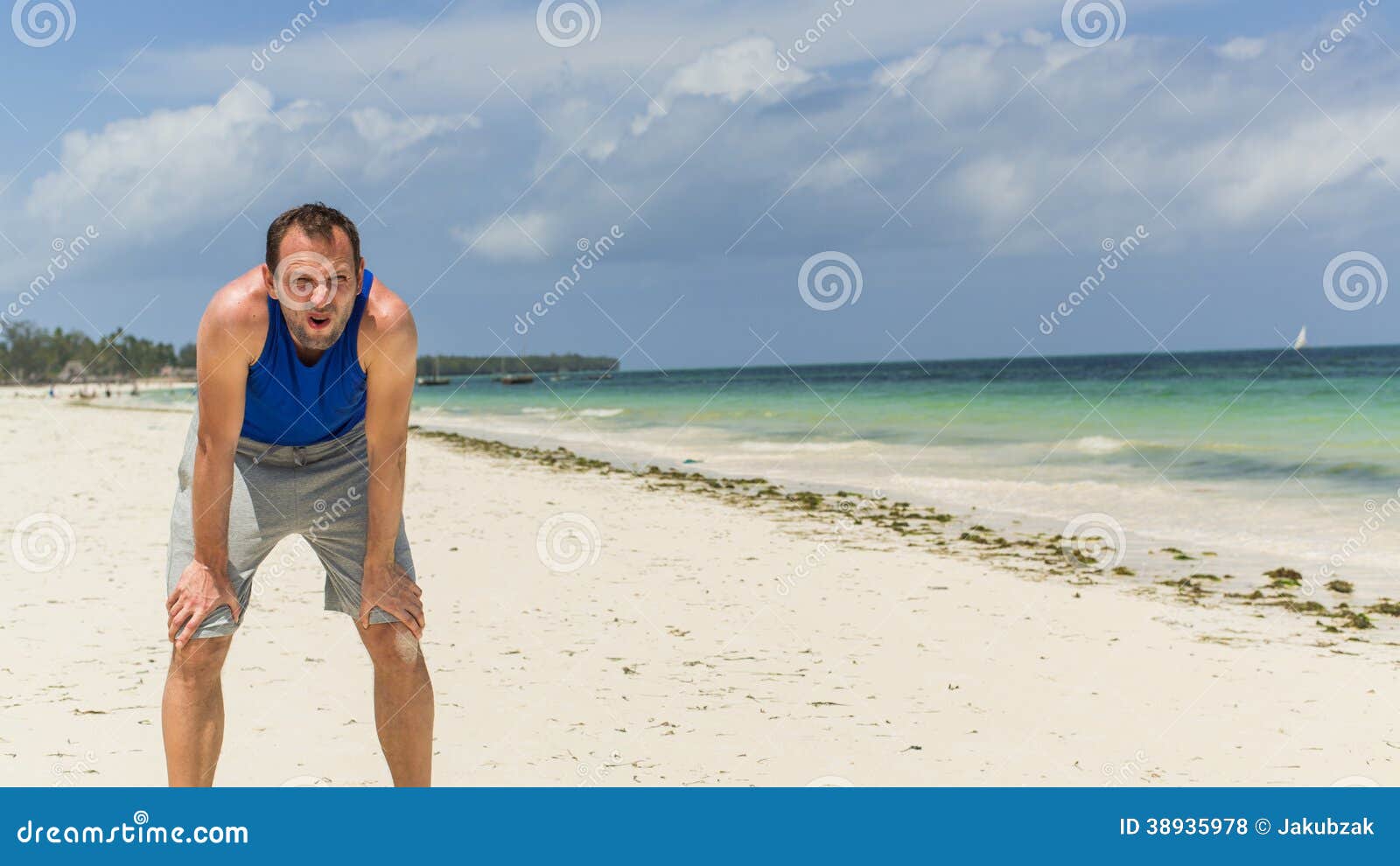 Man in Sport Clothing Resting after Exercise on Beach. Stock Photo ...