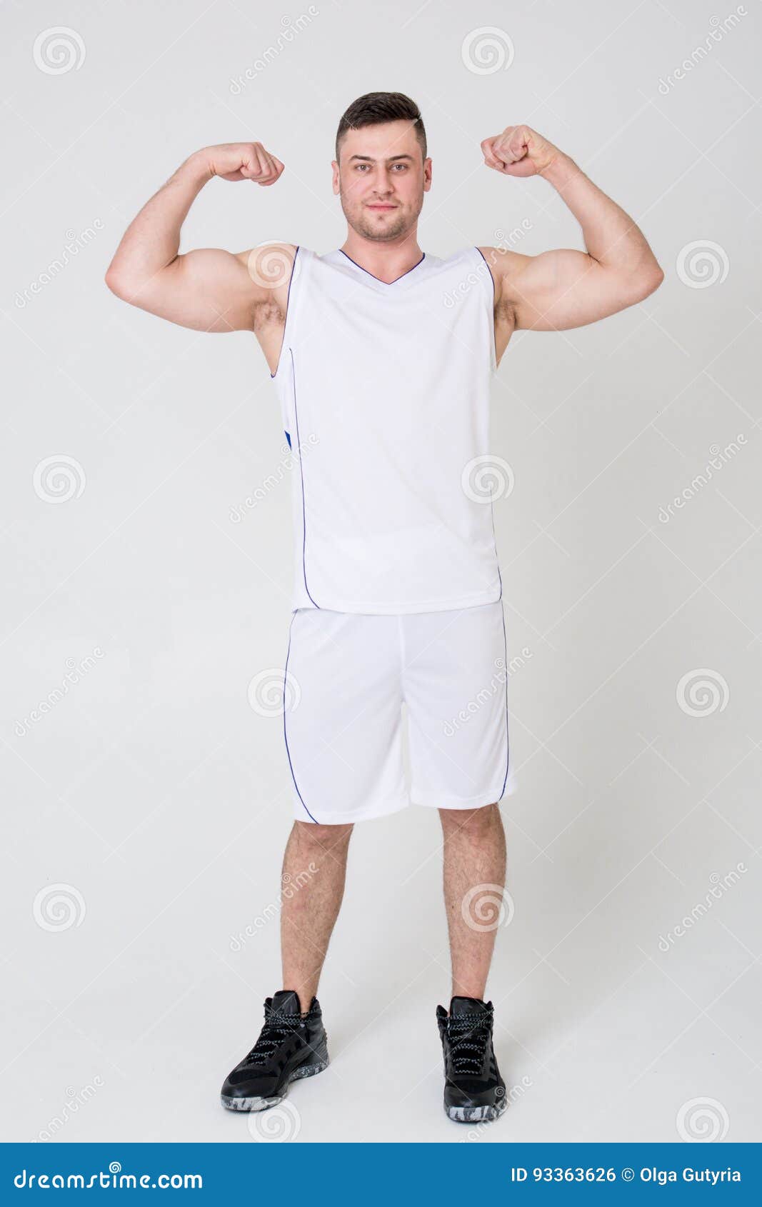 Man in Sports Uniform Shows Biceps Stock Photo - Image of bench, muscle ...