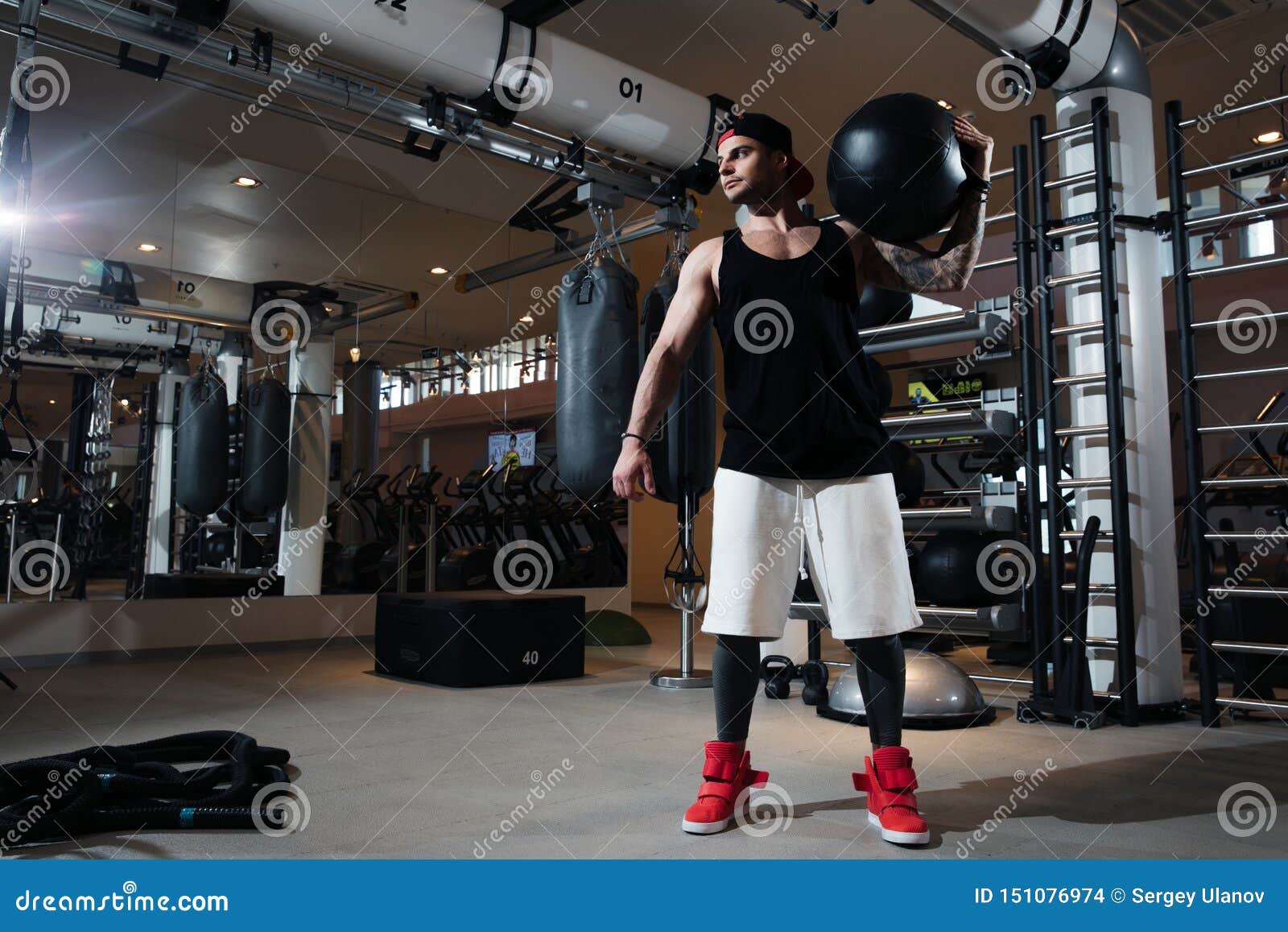 Man in Sportswear is Training in the Gym Stock Photo - Image of ...
