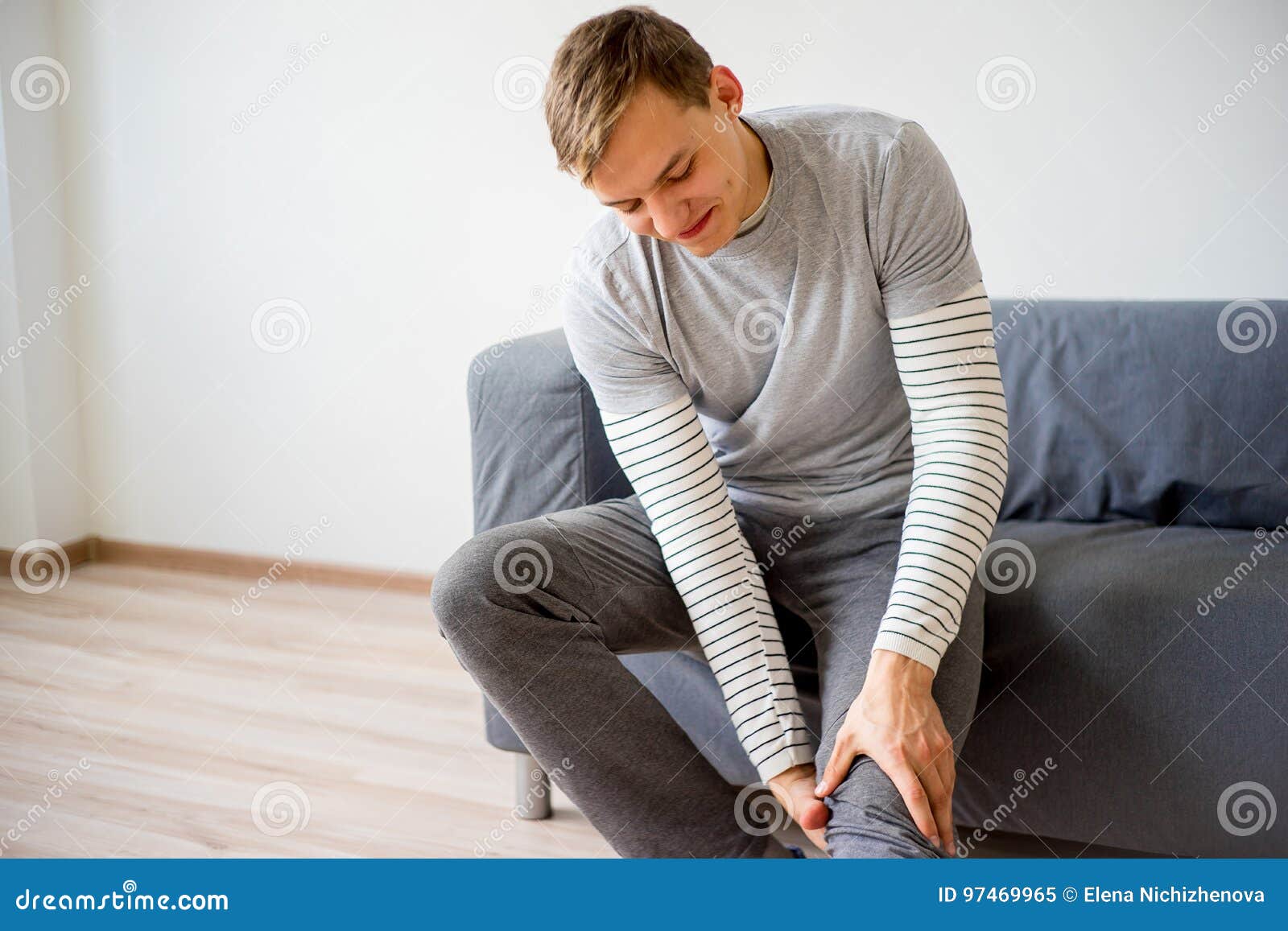Man sprained his leg stock image. Image of health, hand - 97469965