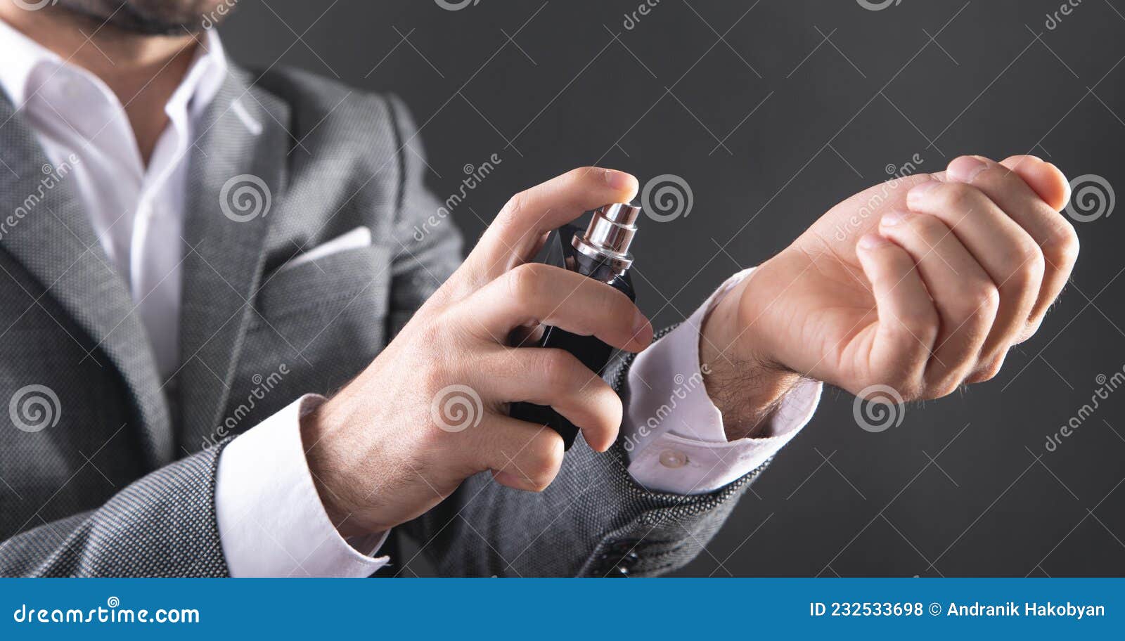 Man Spraying Perfume in Hand Stock Photo - Image of beauty, male: 232533698