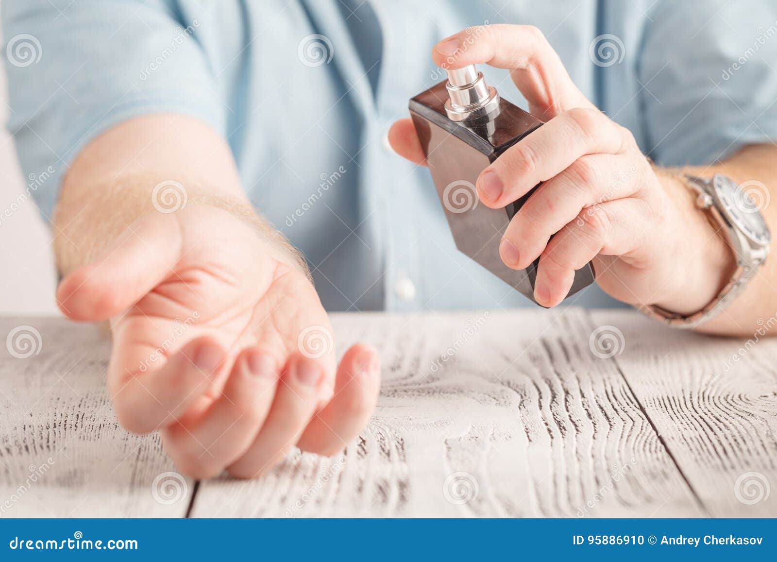 Man Spraying and Smelling Fragrance or Cologne Stock Photo - Image of ...