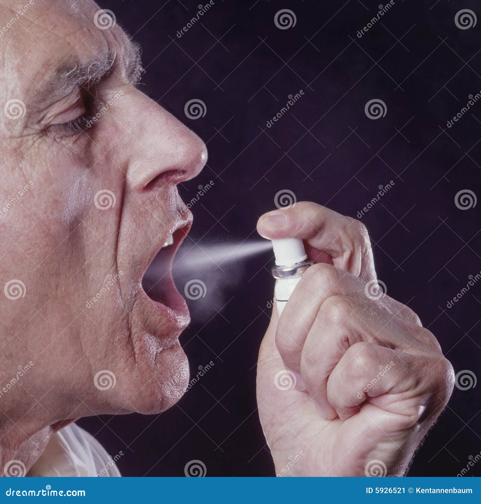 Man Spritzing Medication into Mouth Stock Image - Image of spraying ...