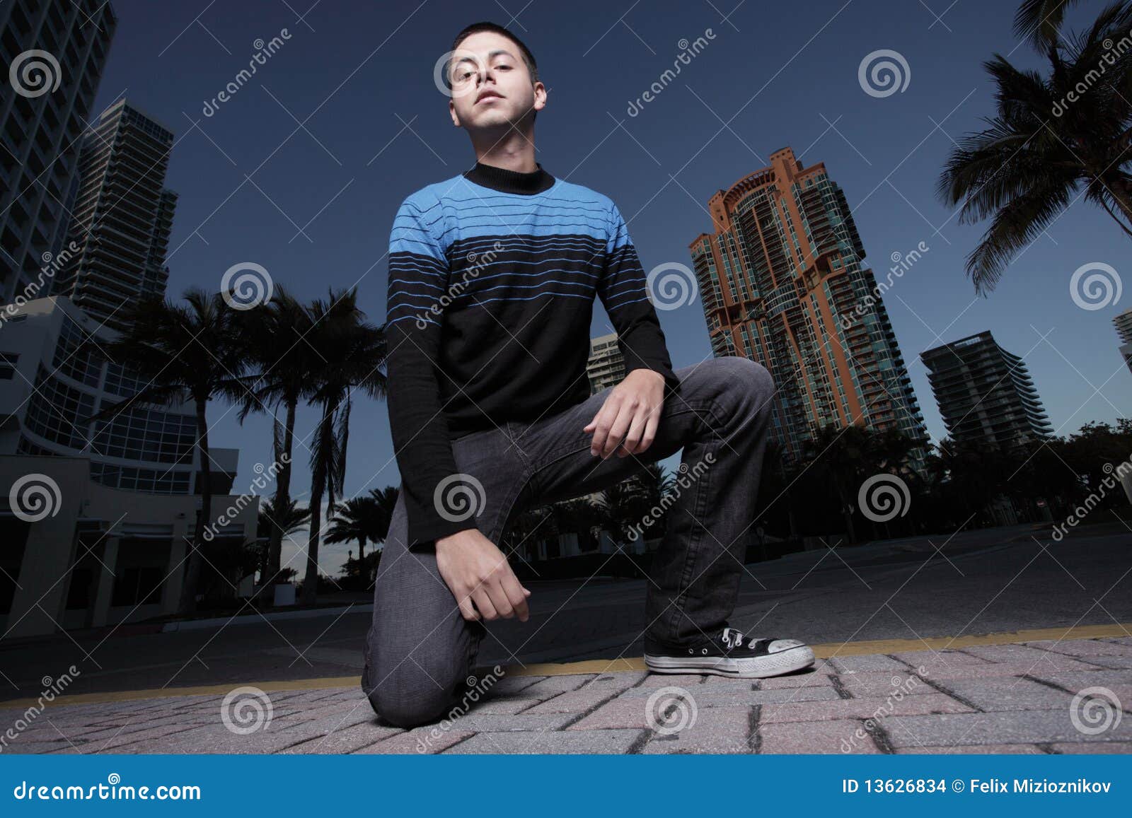 Man squatting stock photo. Image of perspective, angle - 13626834