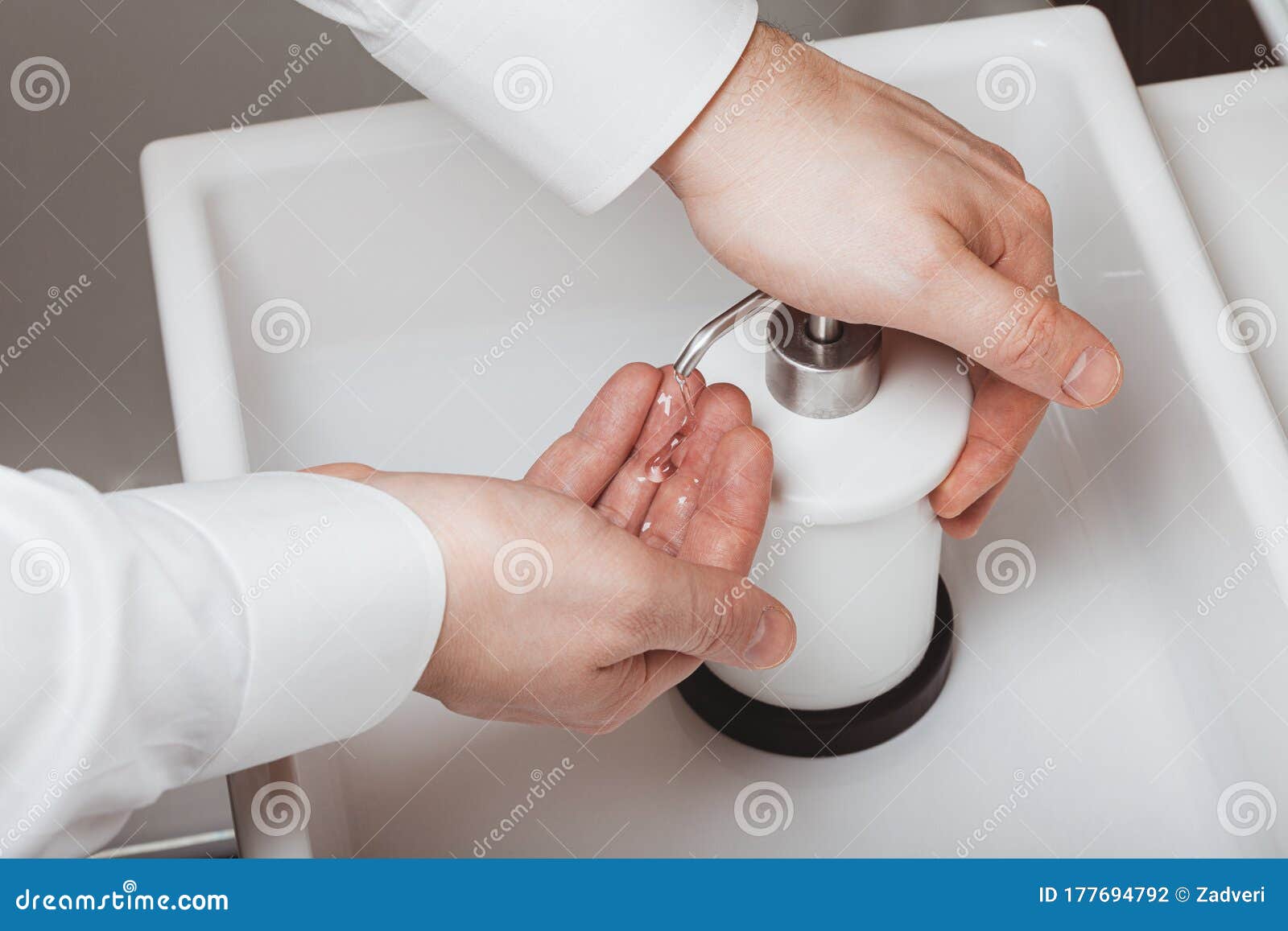 A Man Squeezes Liquid Soap from a Dispenser Stock Photo - Image of ...