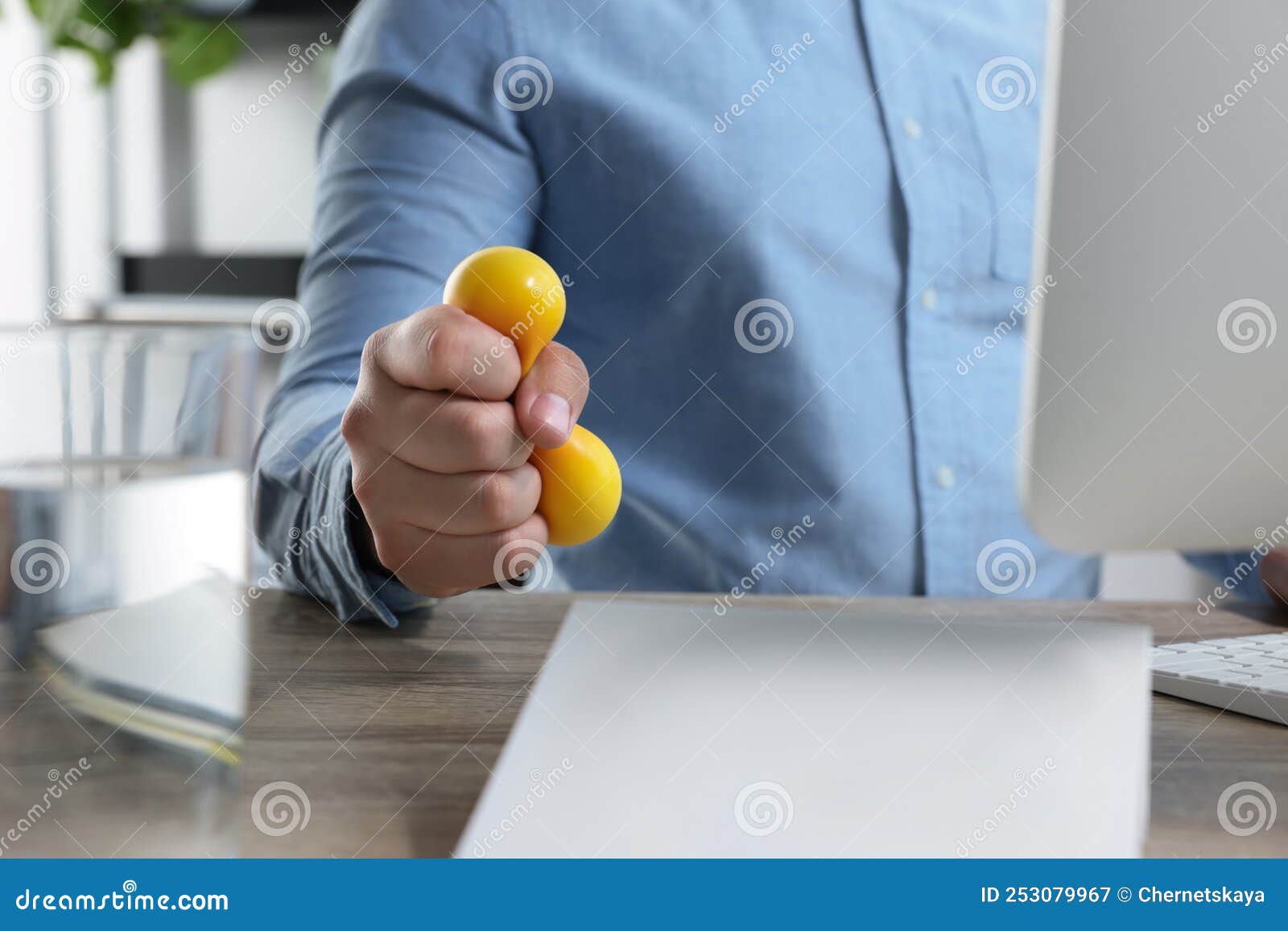 Man Squeezing Antistress Ball while Working with Computer in Office ...