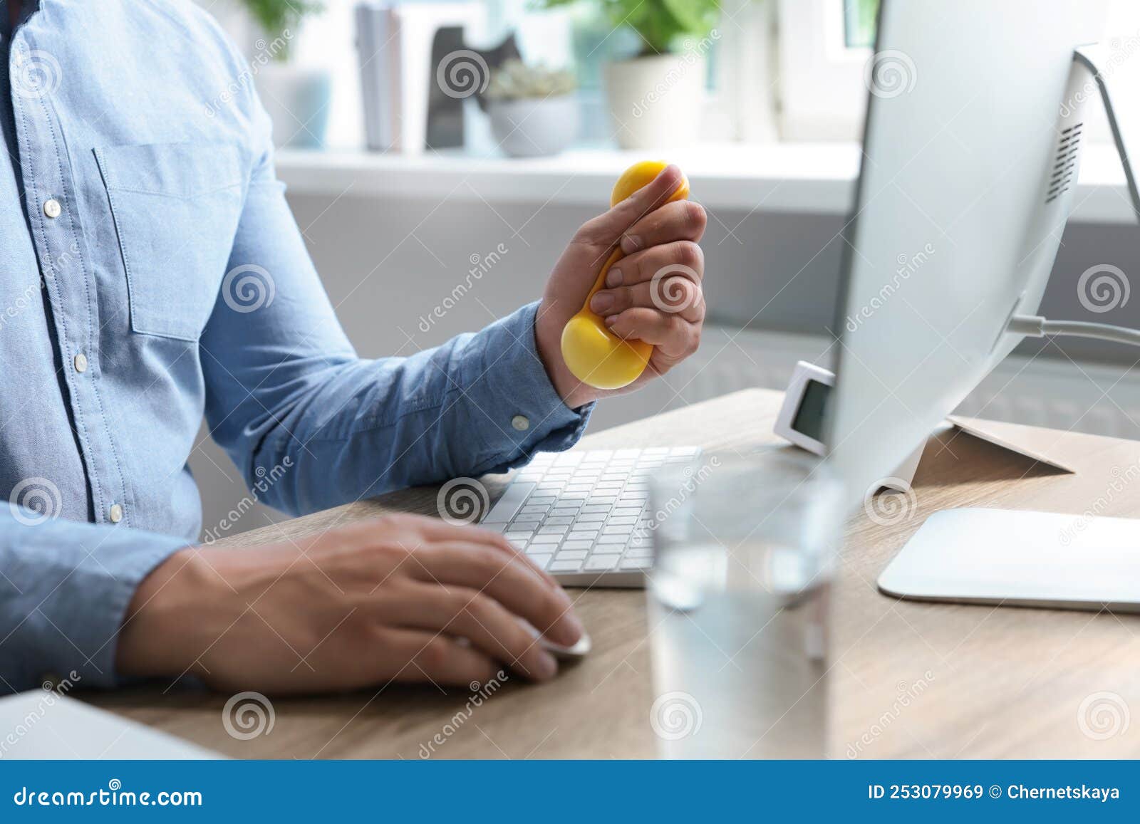 Man Squeezing Antistress Ball while Working with Computer in Office ...
