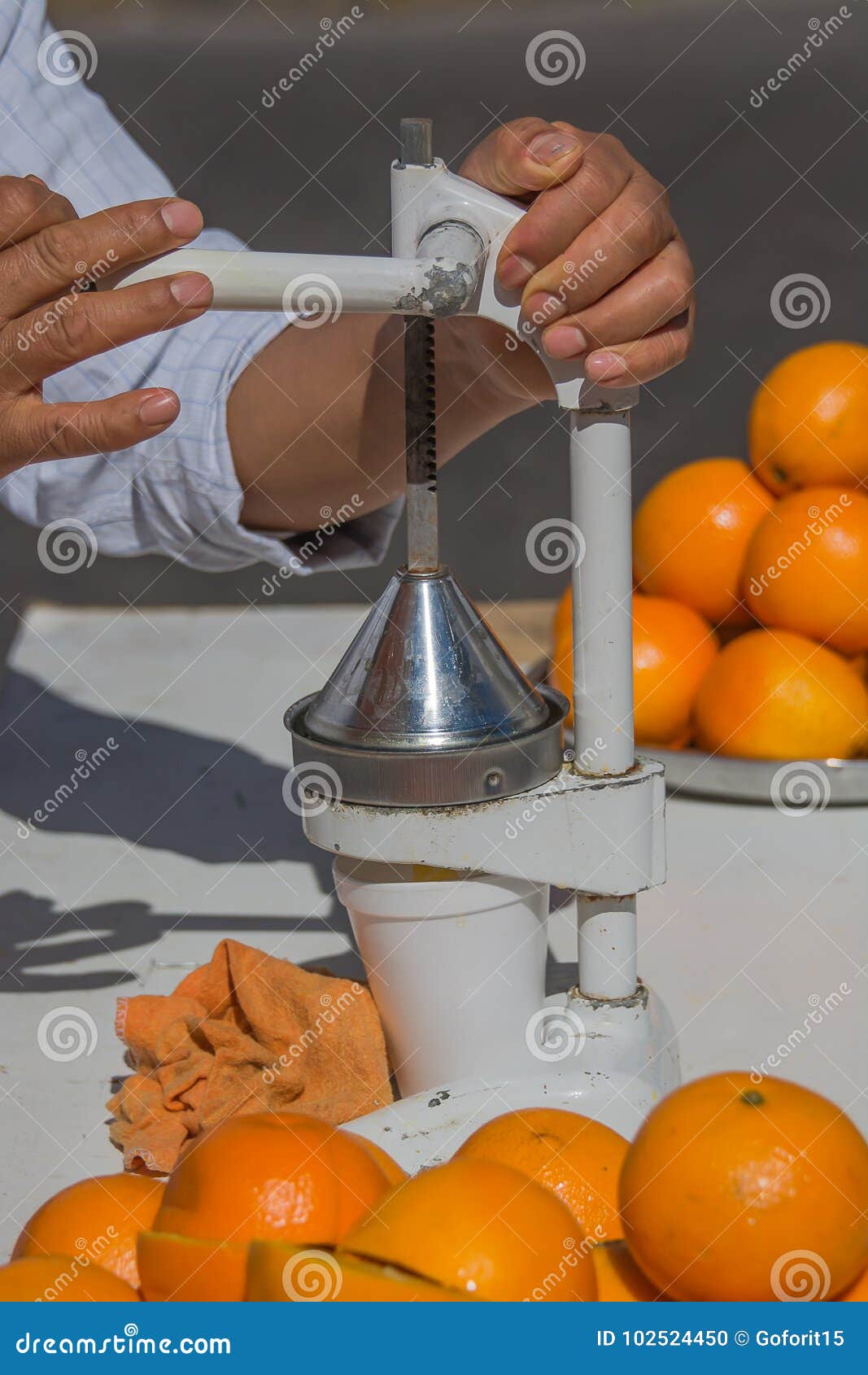 Man squeezing orange juics stock photo. Image of drink - 102524450