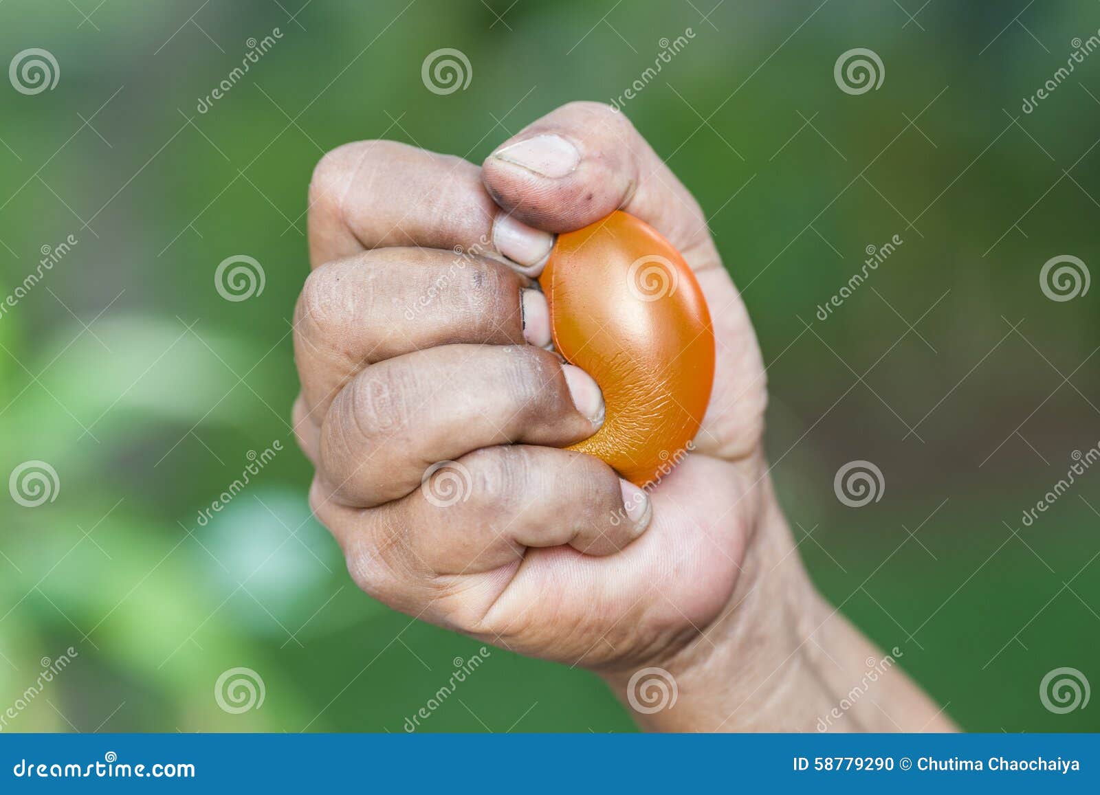 A Man Squeezing a Stress Ball Stock Photo - Image of fingers, male ...