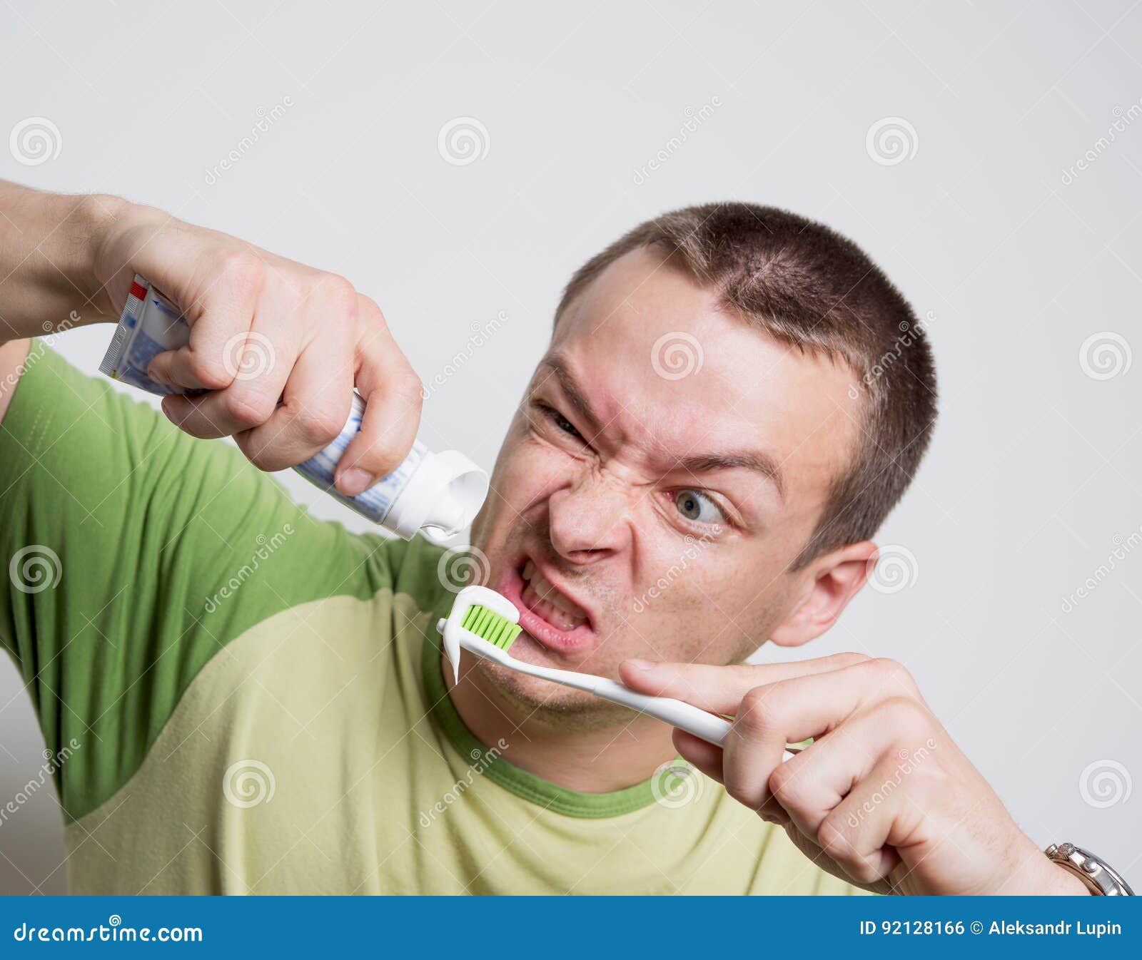 Man squeezing toothpaste stock photo. Image of prevention - 92128166