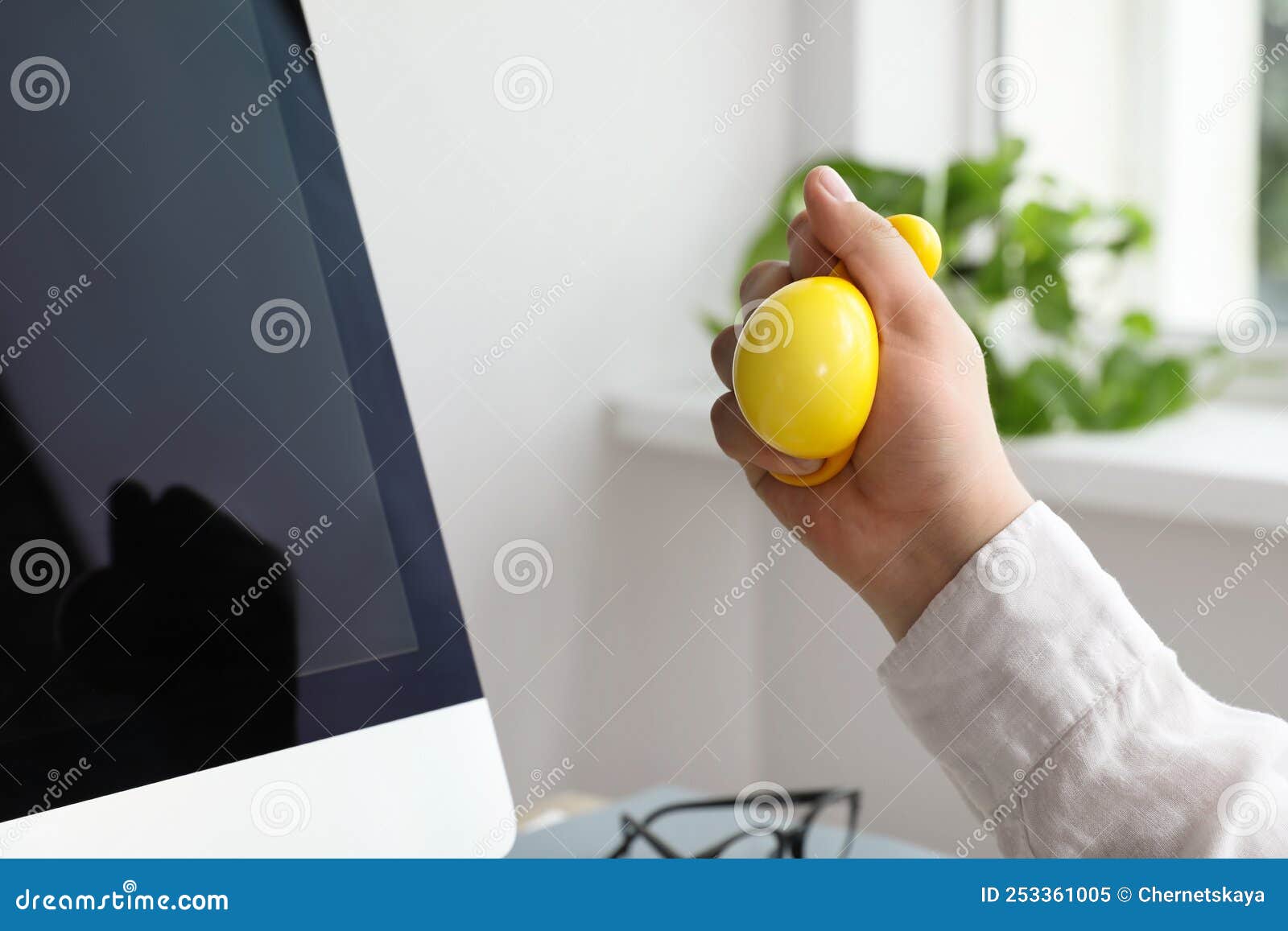 Man Squeezing Yellow Stress Ball in Office, Closeup Stock Image - Image ...