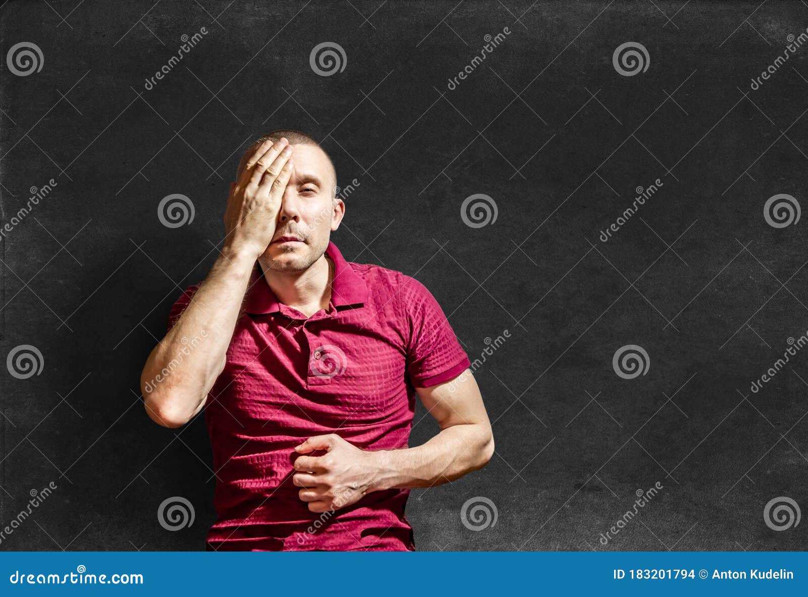 The Man Squinted and Put His Hand Over One of His Eyes Stock Photo ...