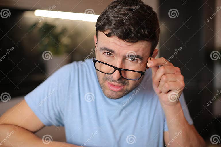 Man Squinting and Putting His Eyeglasses Down Stock Image - Image of ...