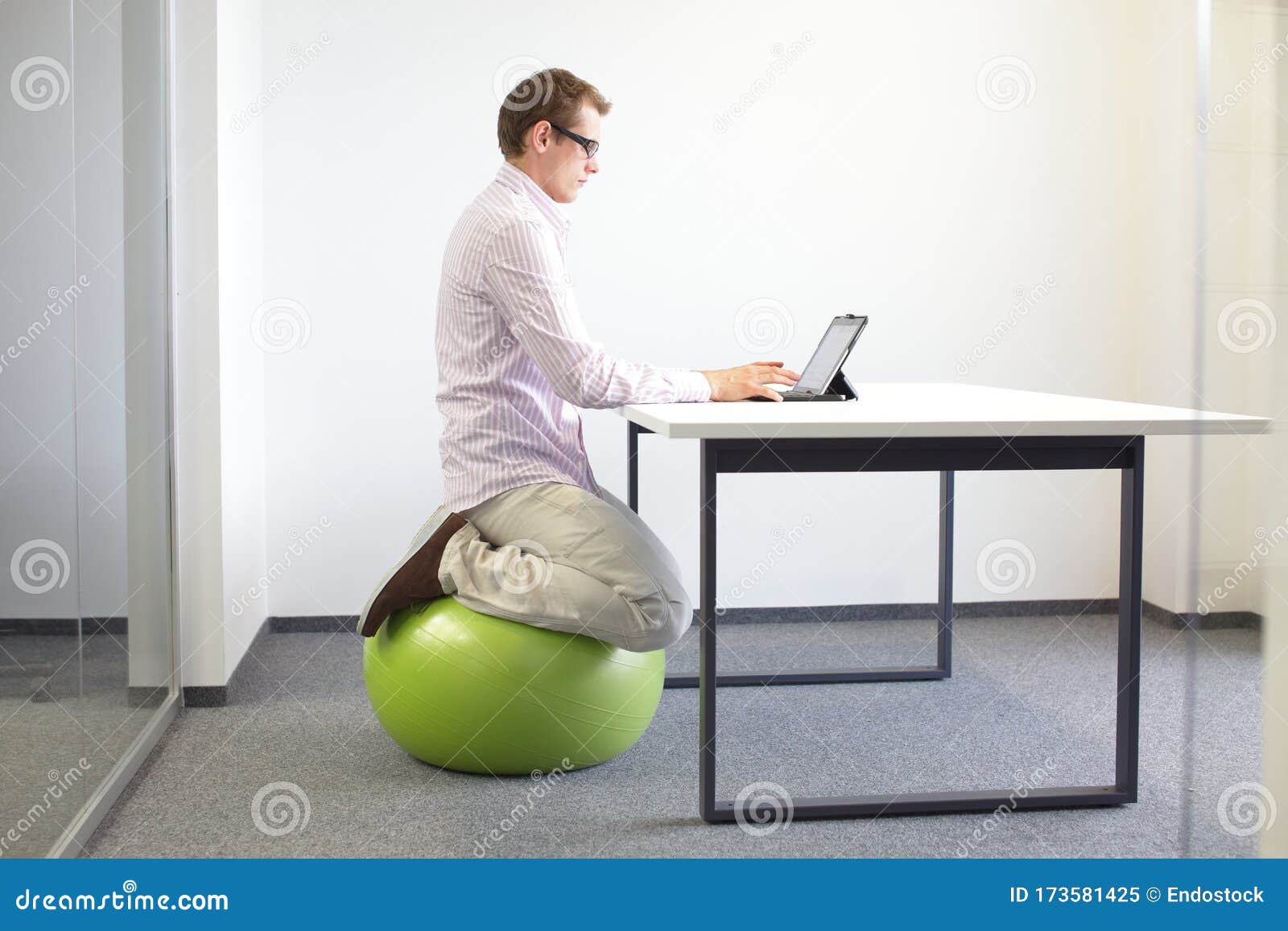 Man on Stability Ball Working with Tablet Stock Image - Image of mobile ...