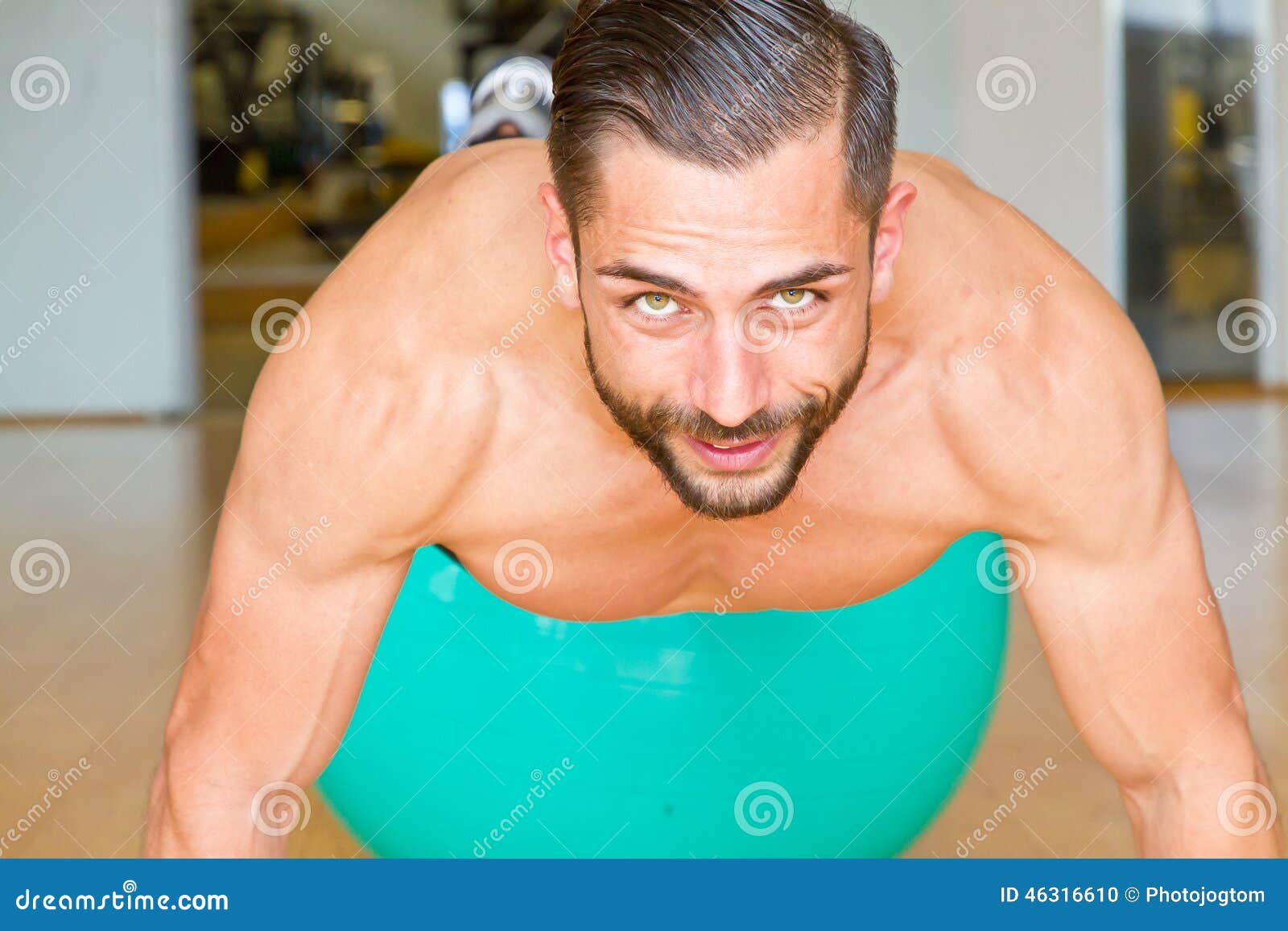 Man on a stability ball stock photo. Image of looking - 46316610