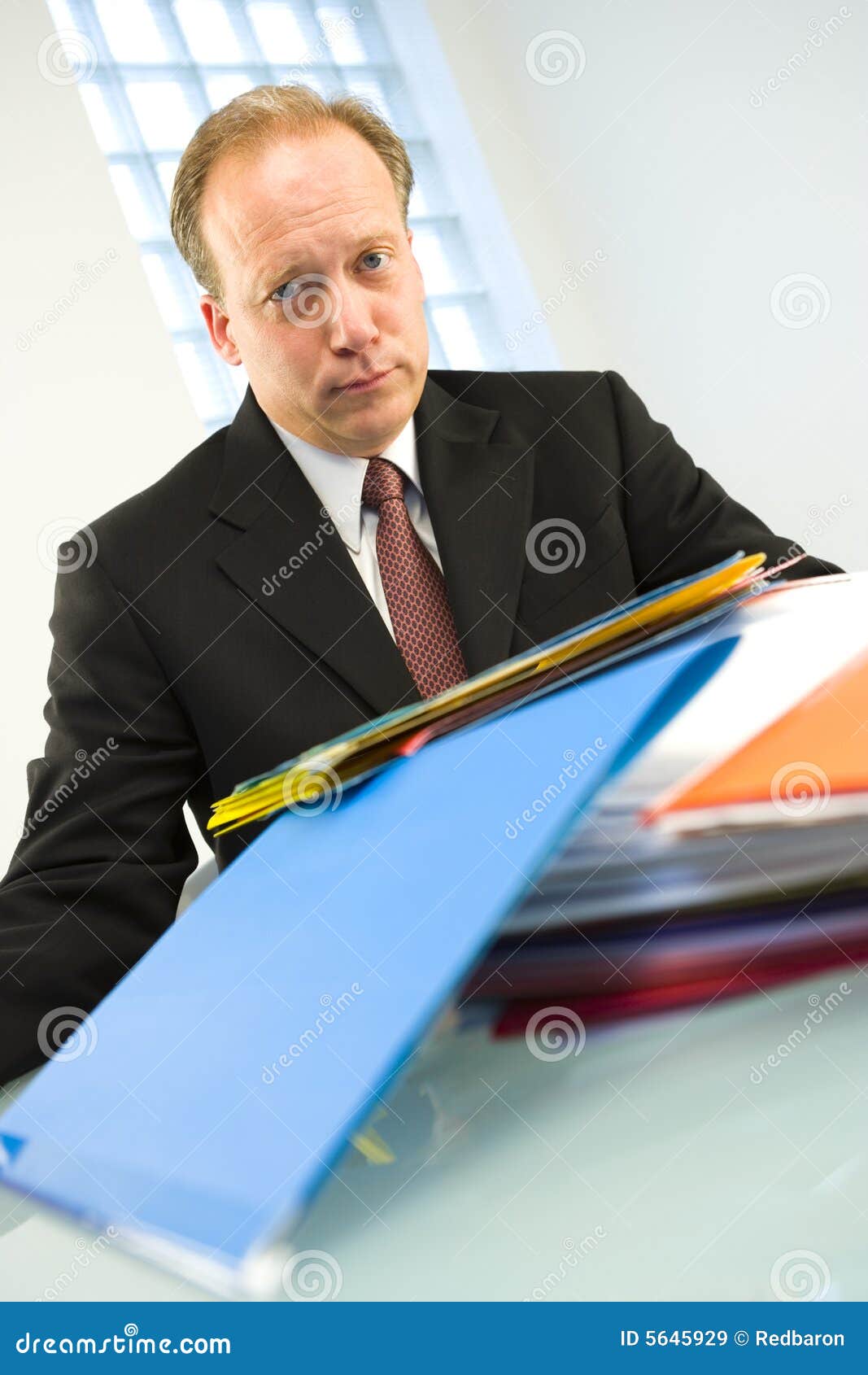 Man with stack of folders stock image. Image of adult - 5645929 Man with stack of folders stock image. Image of adult - 5645929
