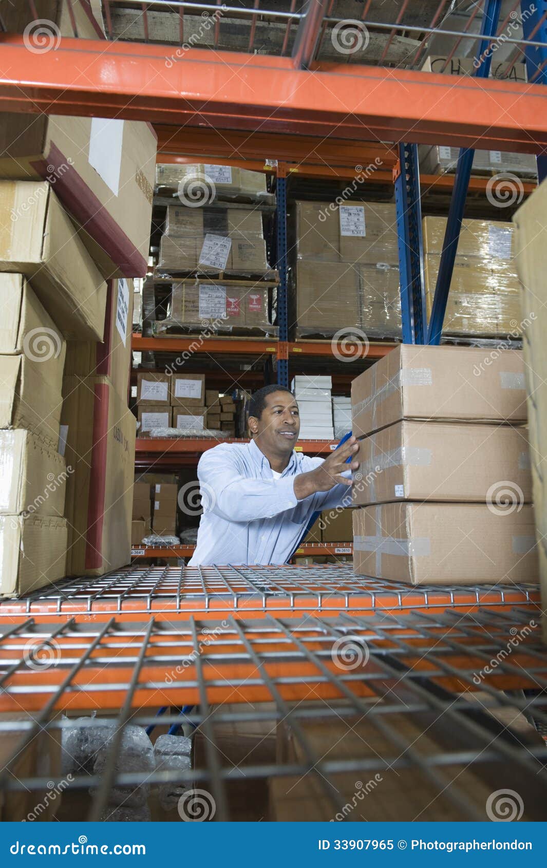 Man Stacking Boxes in Warehouse Stock Image - Image of inspecting ...
