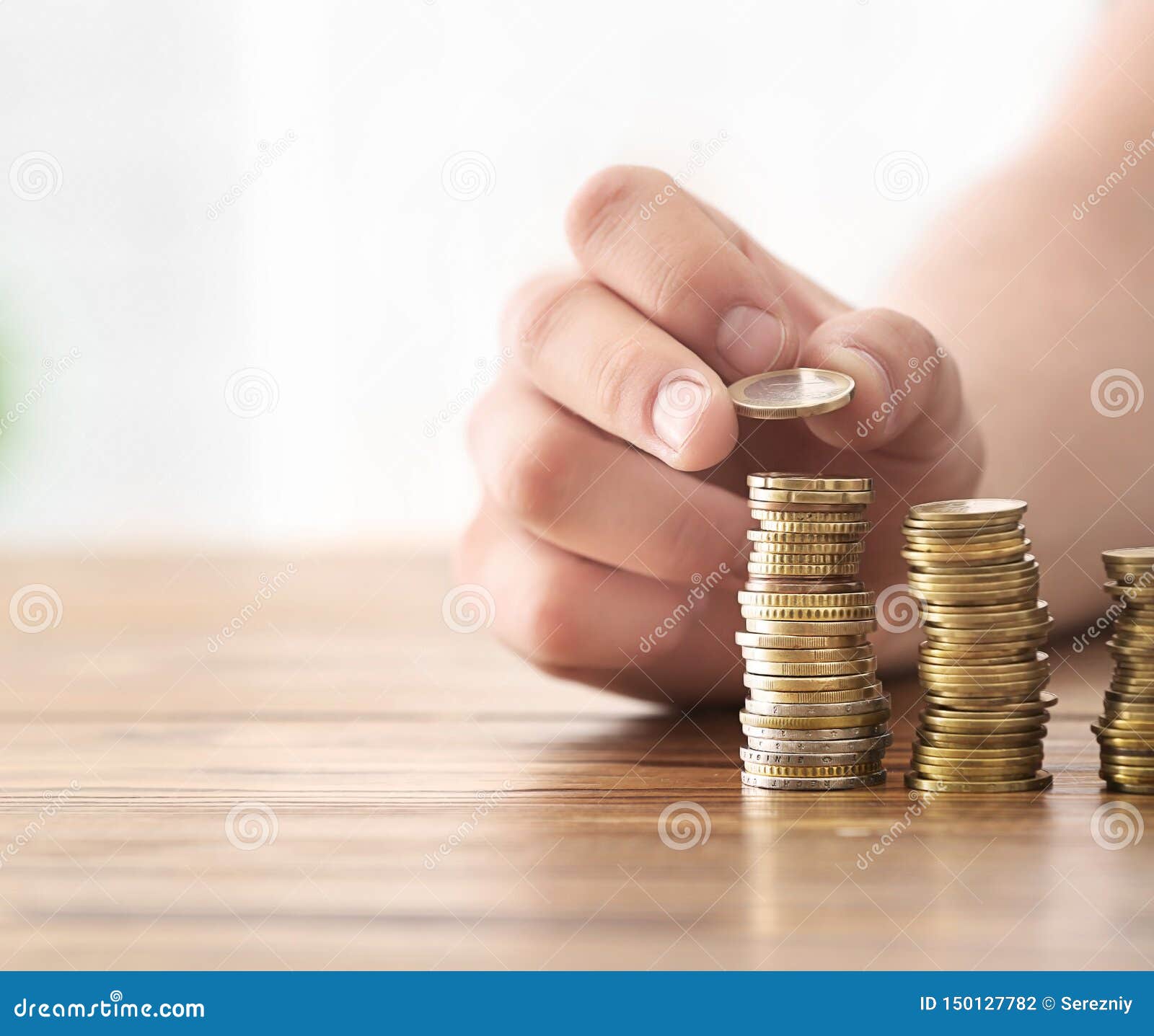Man Stacking Coins on Table. Savings Concept Stock Photo - Image of ...
