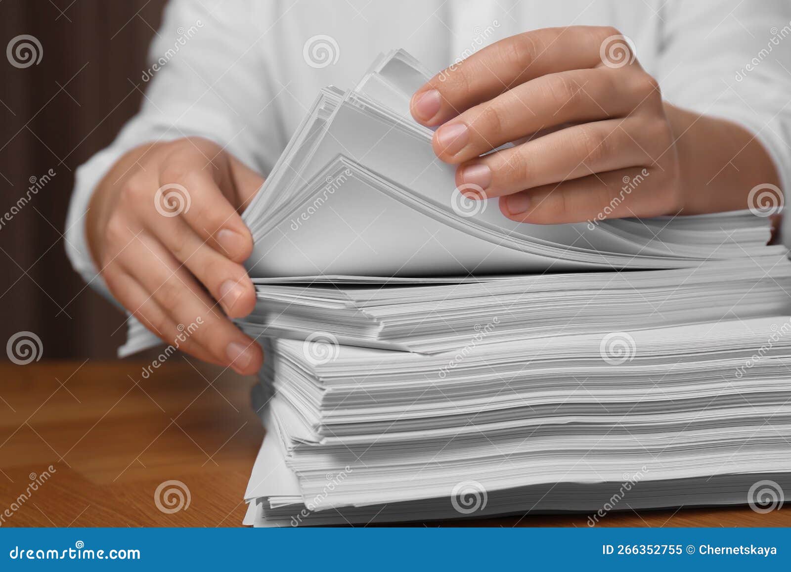 Man Stacking Documents at Table in Office, Closeup Stock Image - Image ...
