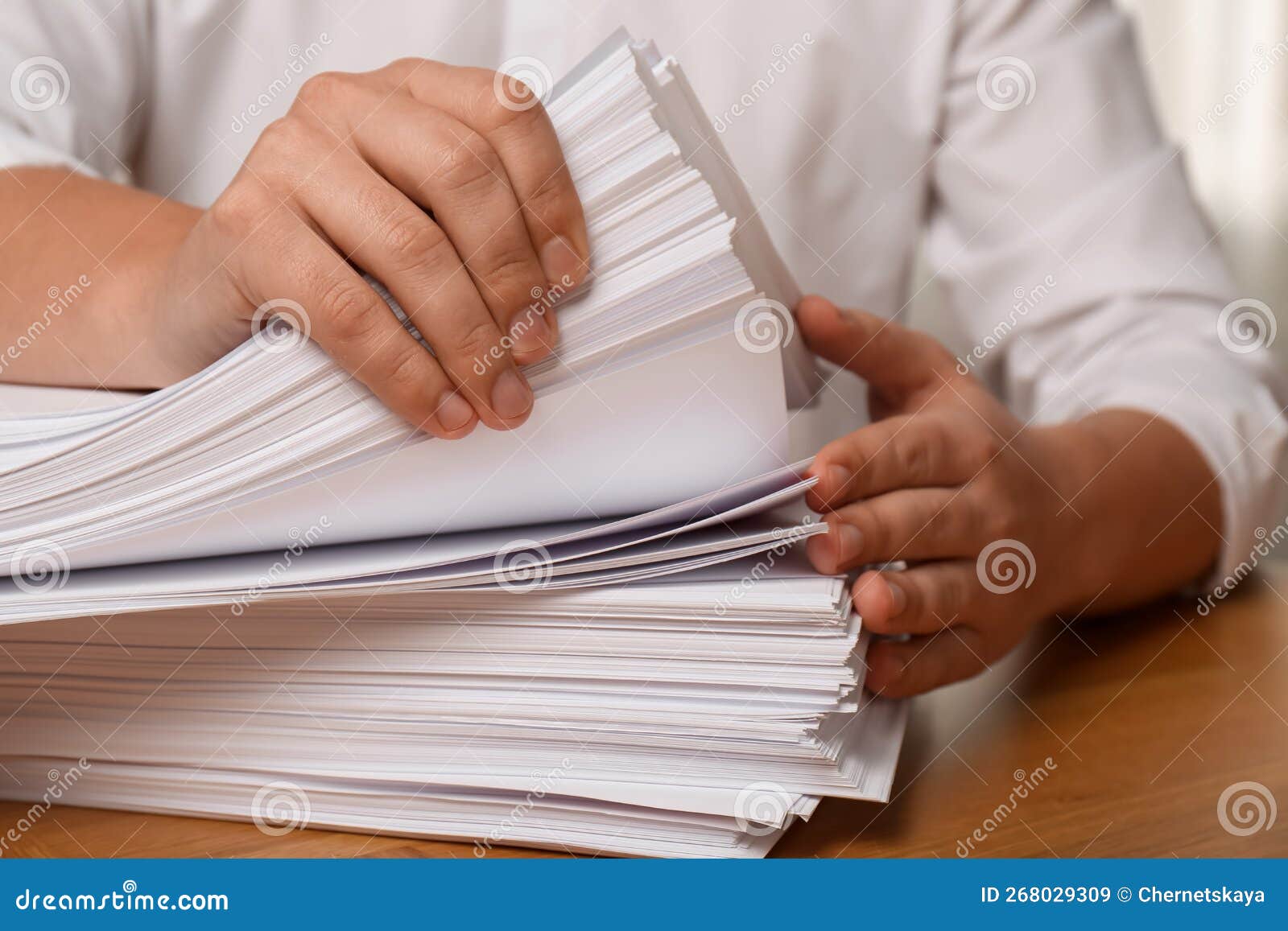 Man Stacking Documents at Table in Office, Closeup Stock Image - Image ...