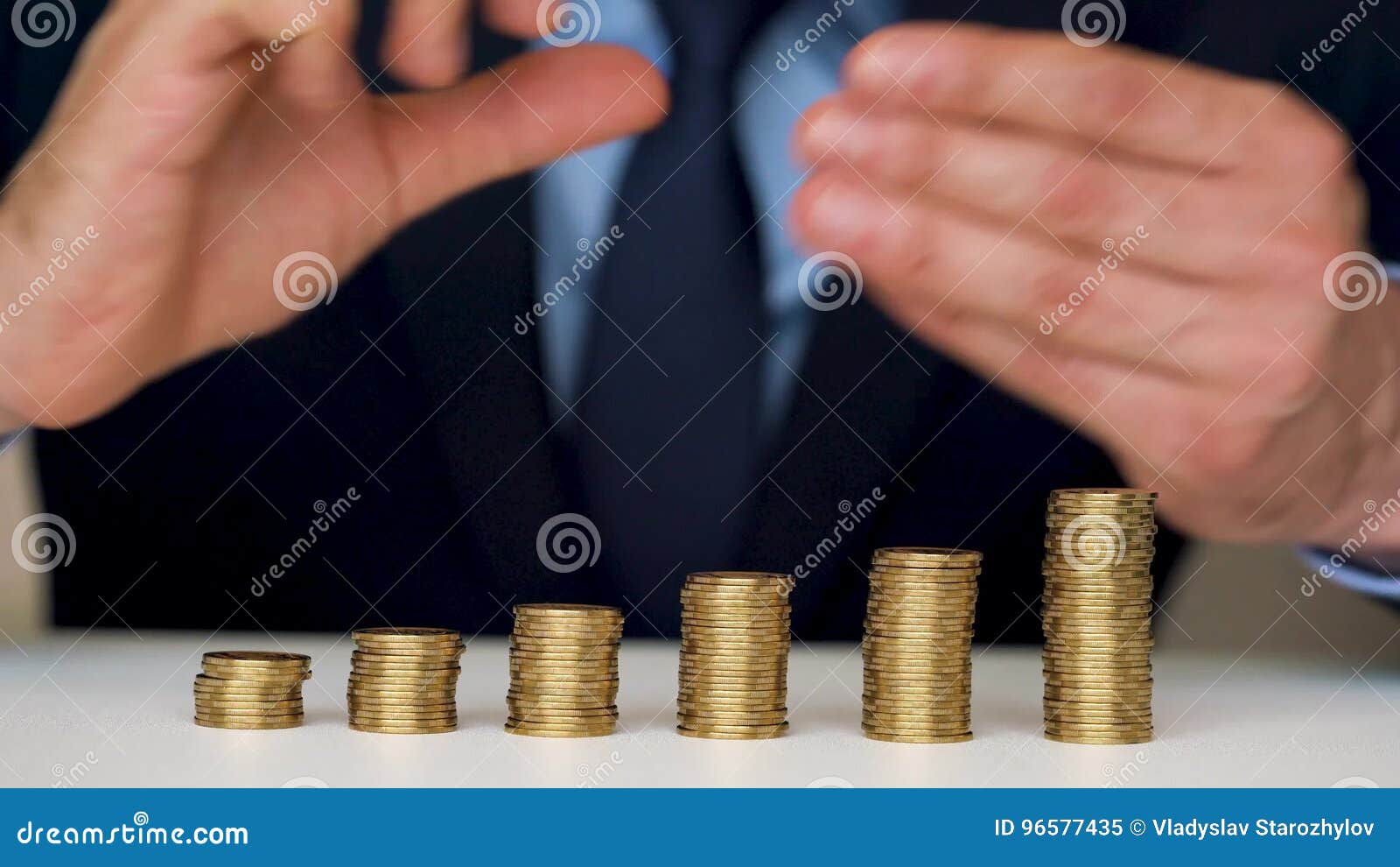 Man Stacking Gold Coins into Increasing Columns Stock Video - Video of ...