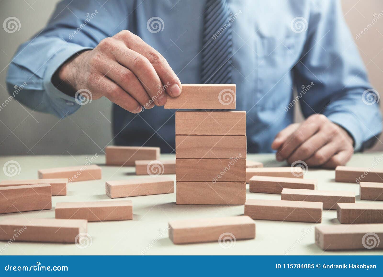 Man Stacking Wooden Blocks. Development Concept Stock Image - Image of ...