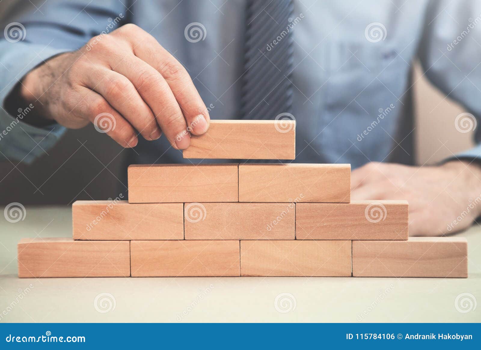 Man Stacking Wooden Blocks. Development Concept Stock Photo - Image of ...