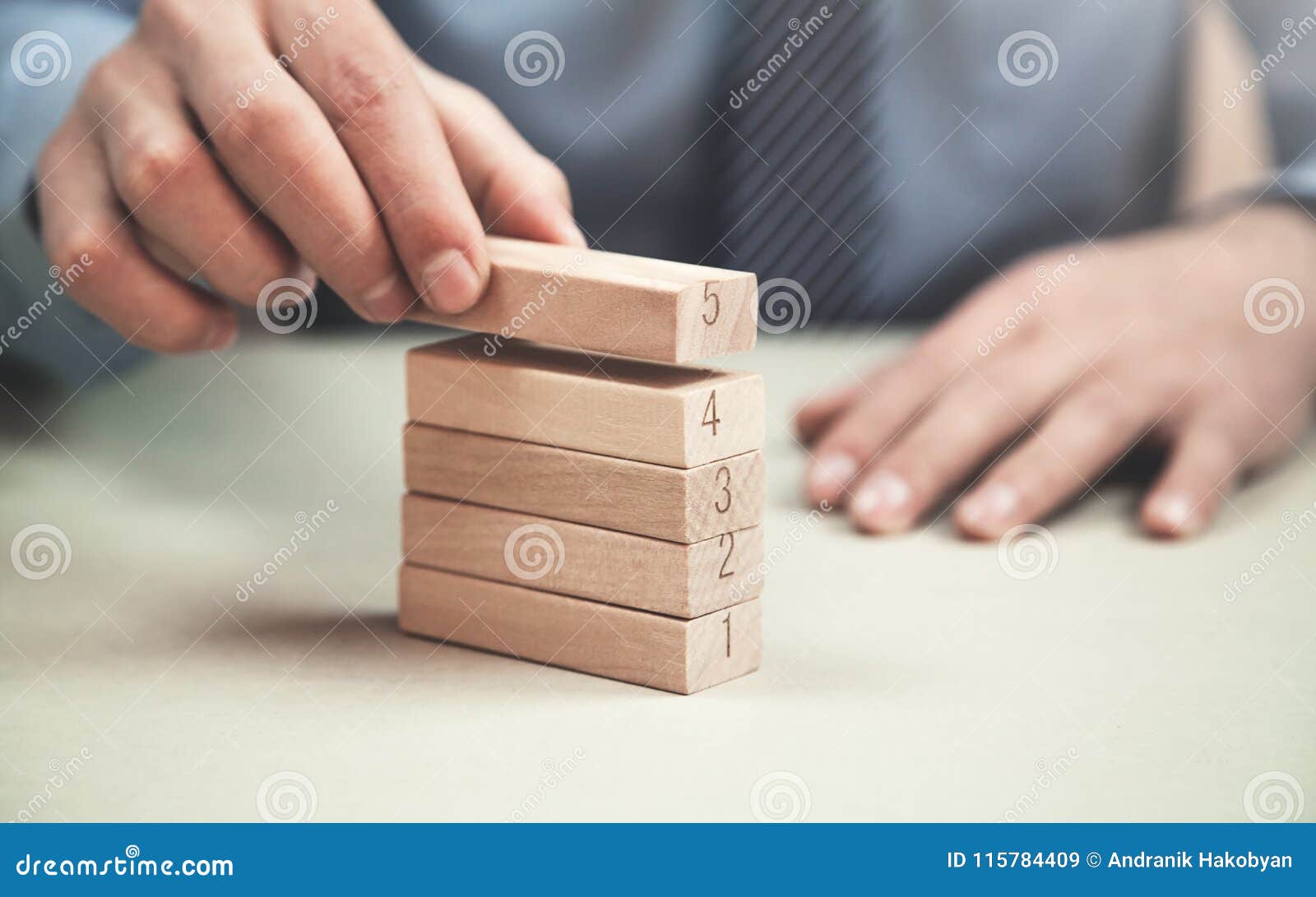 Man Stacking Wooden Blocks. Development Concept Stock Image - Image of ...