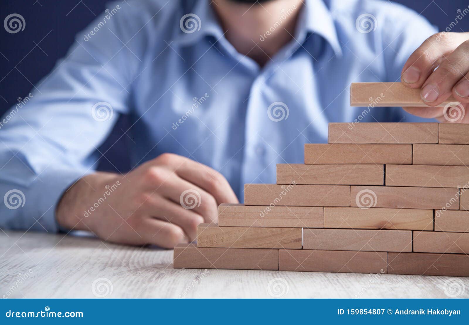 Man Stacking Wooden Blocks. Development Concept Stock Image - Image of ...