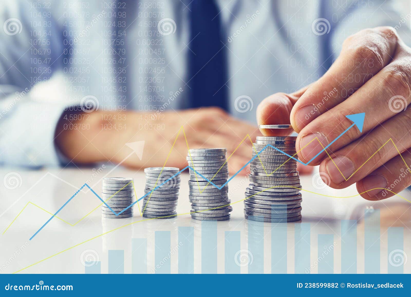 A Man Stacks a Stack of Coins, with a Savings Chart Stock Photo - Image ...