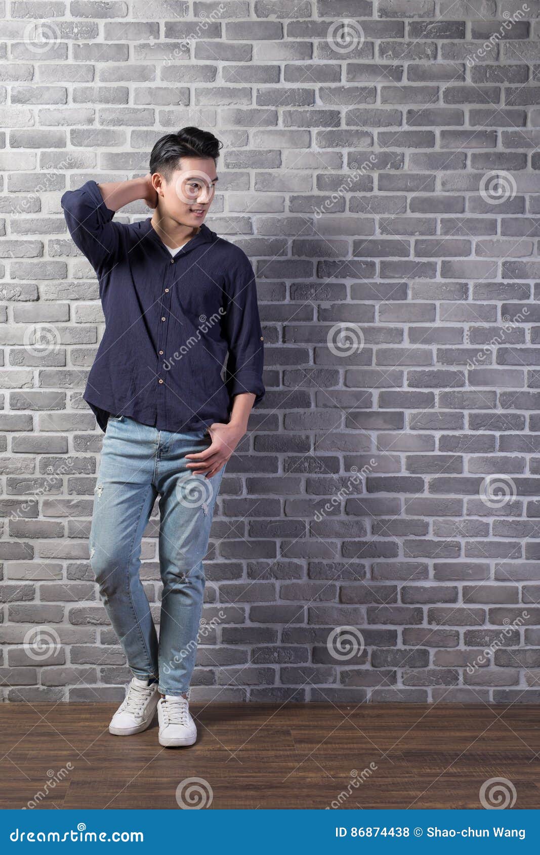 Man stand with brick wall stock photo. Image of japanese - 86874438