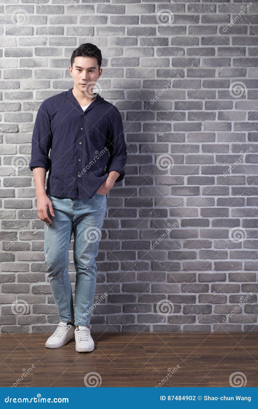 Man stand with brick wall stock photo. Image of space - 87484902