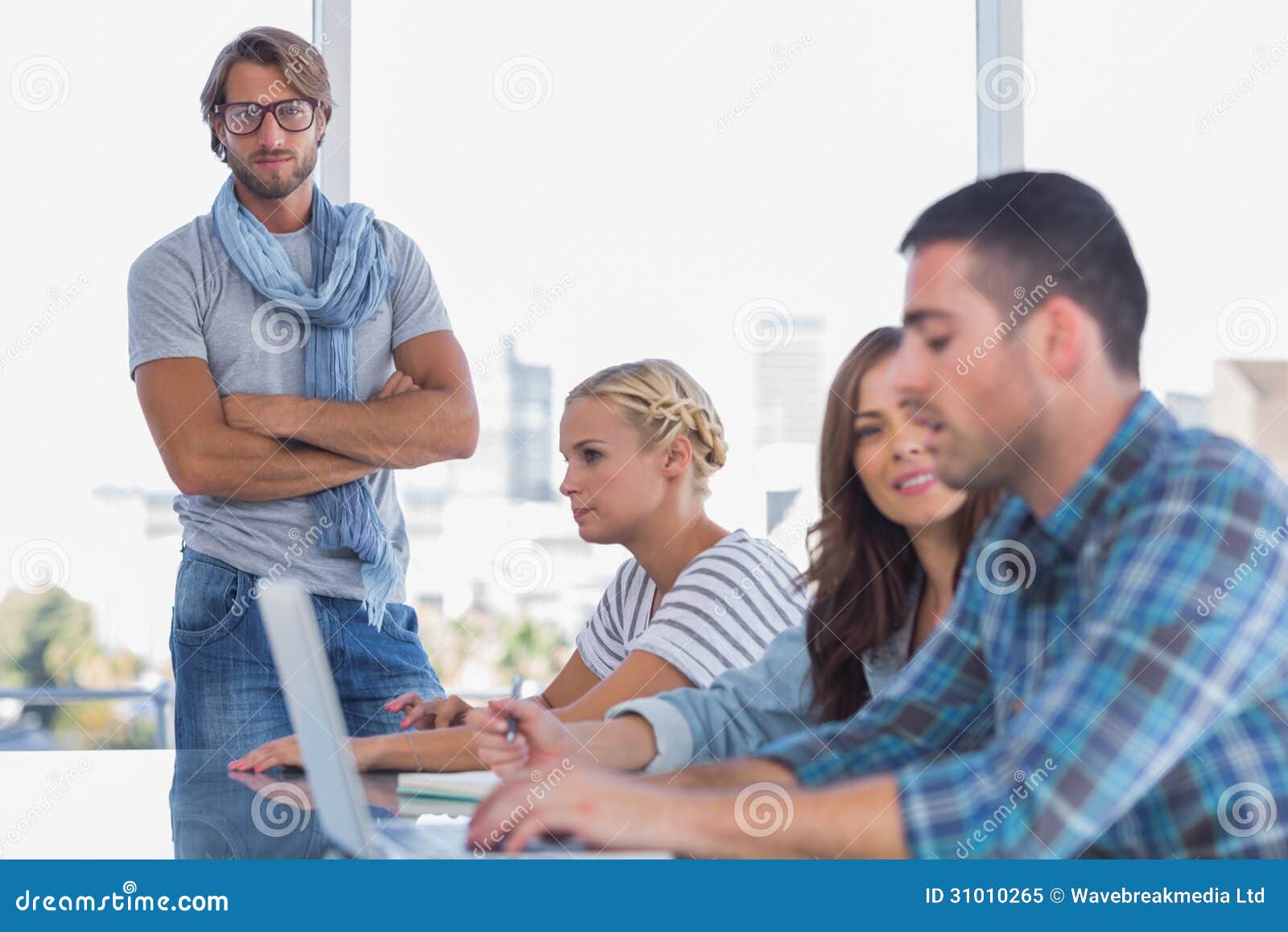 Man Standing with Arms Folded in Creative Office Stock Image - Image of ...