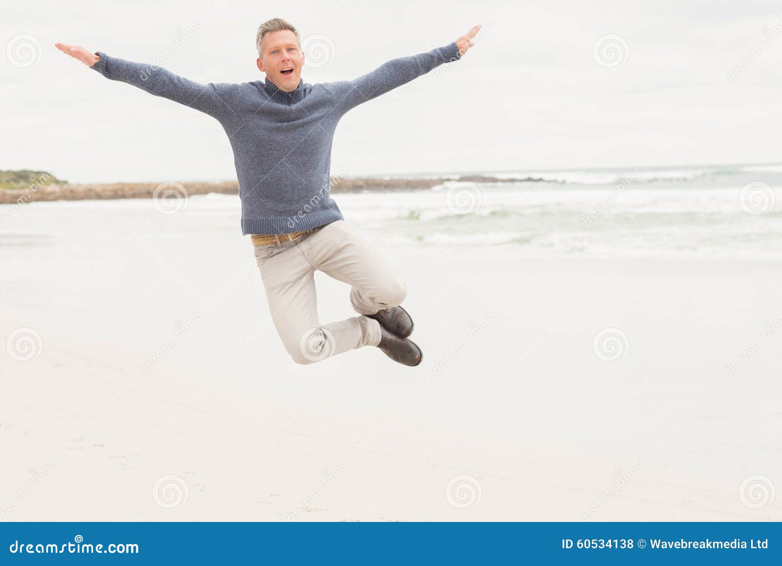 Man Standing with Arms Out Wide Stock Photo - Image of ocean, sunny ...