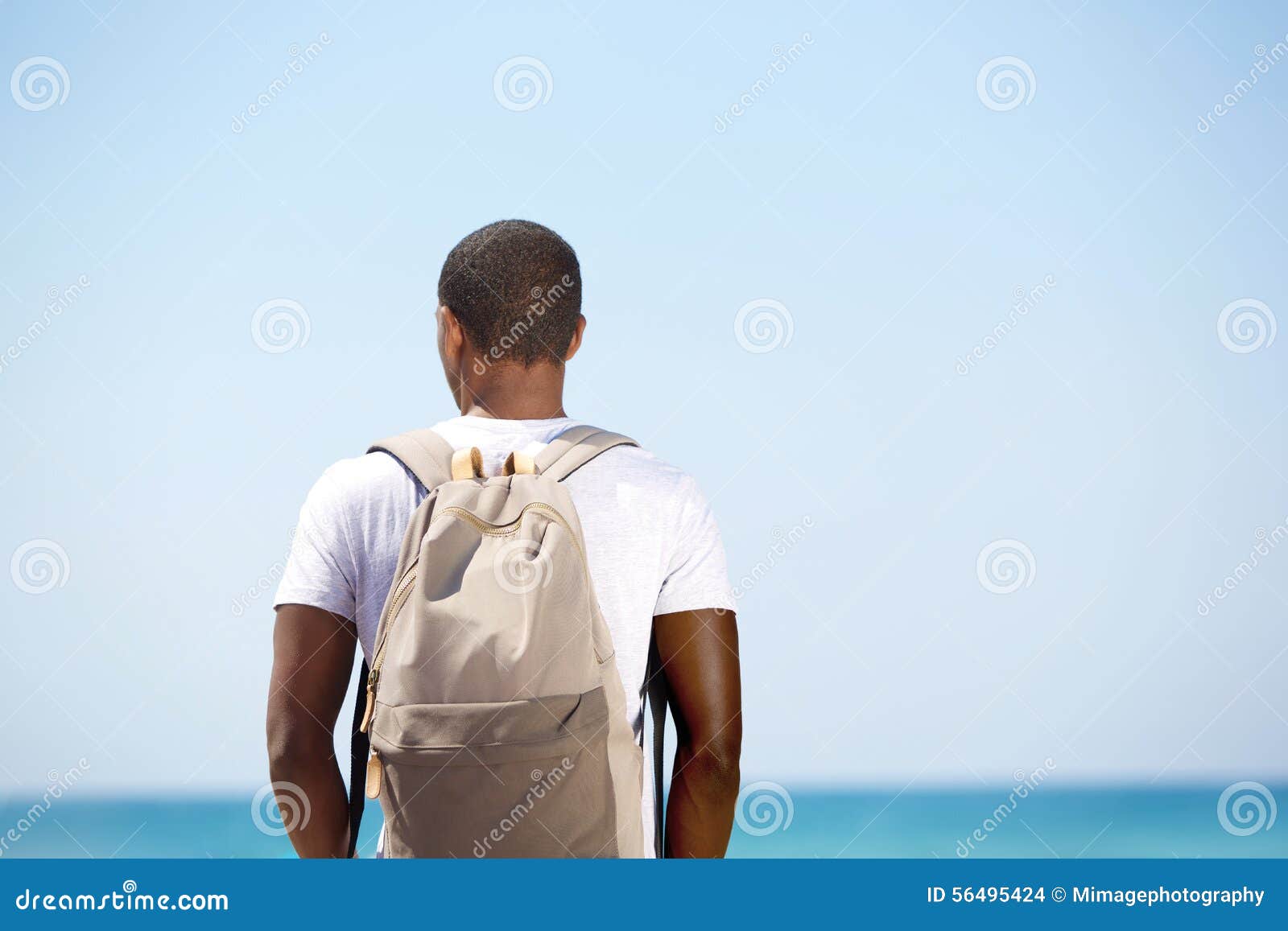 Man Standing with Backpack by the Sea Stock Photo - Image of rear ...