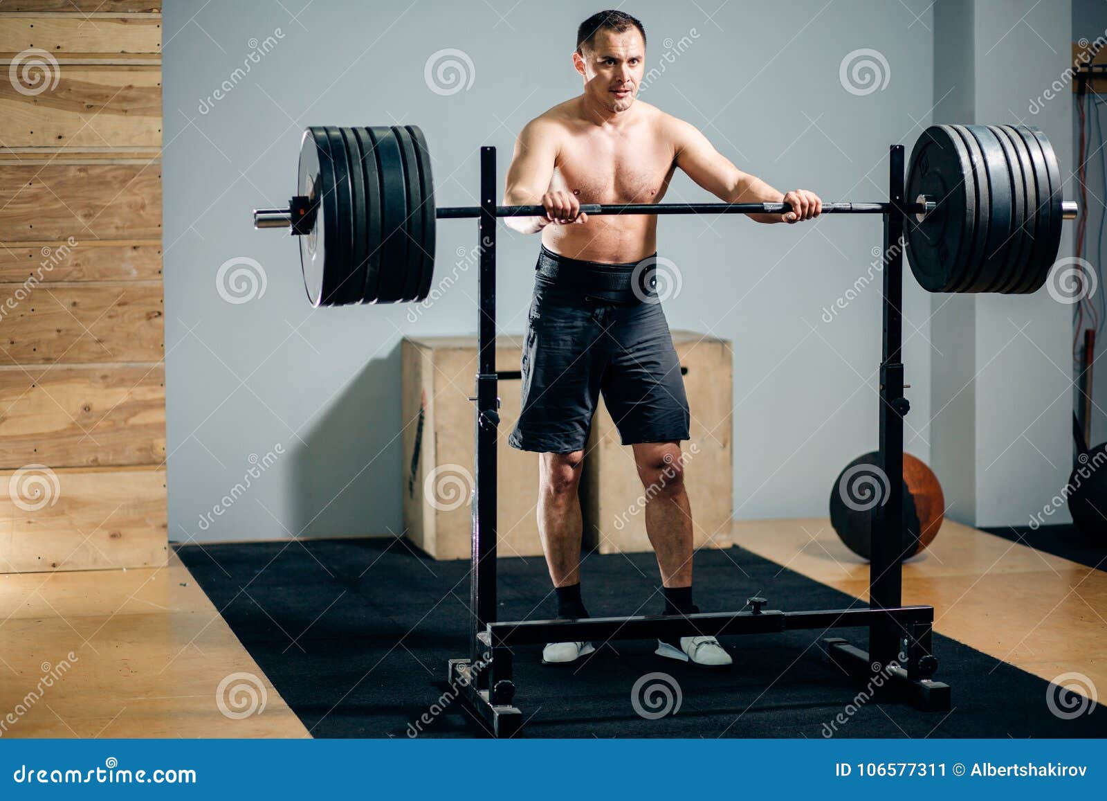 Man Standing by a Barbell Safety Stand in a Gym Stock Image - Image of ...