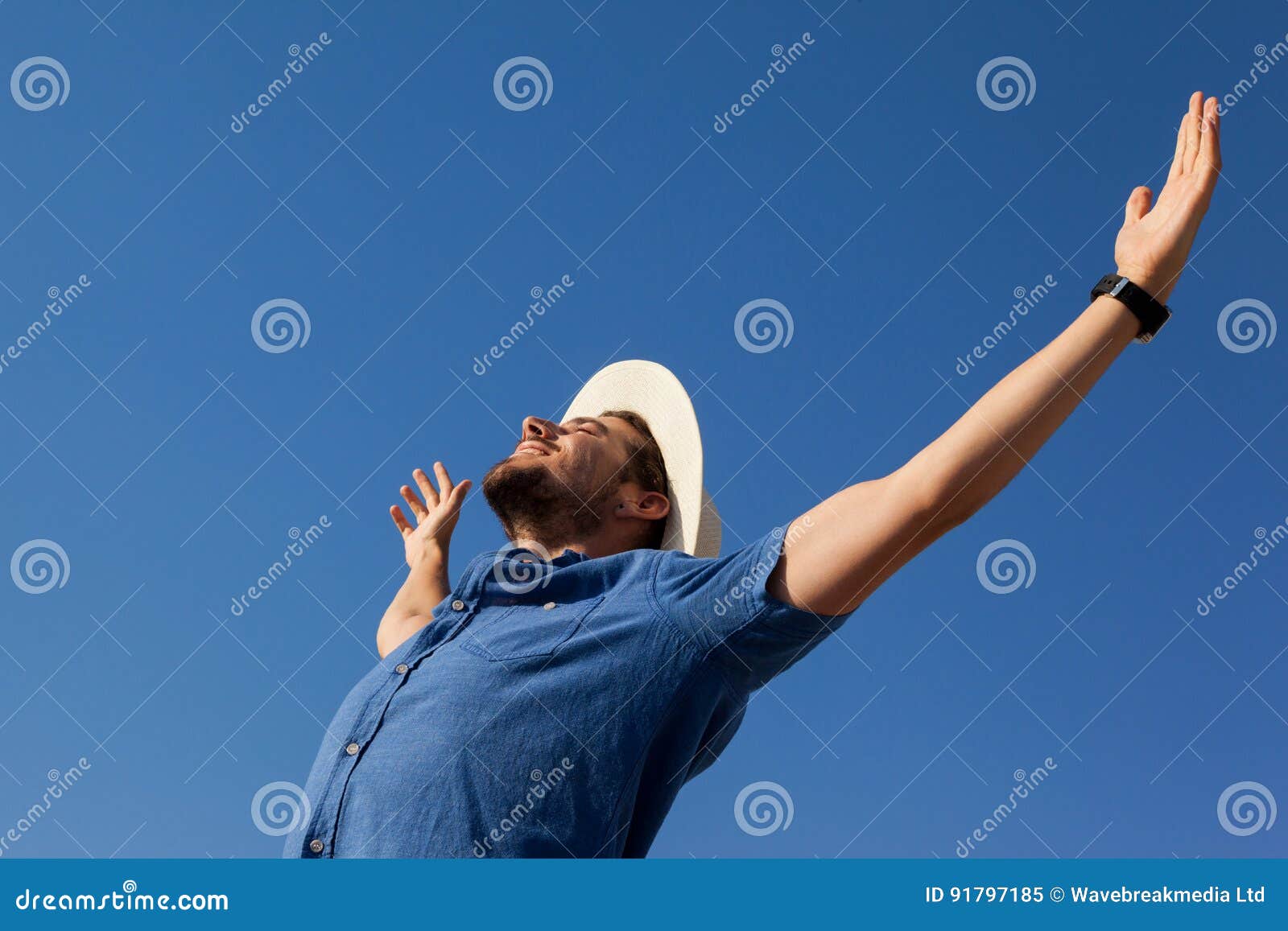 Man Standing at Beach with Arms Outstretched Stock Image - Image of ...