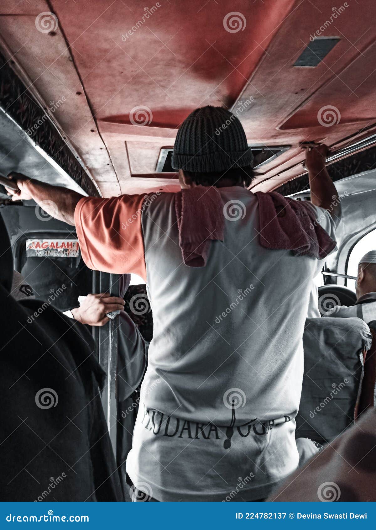 A man standing in a bus editorial photography. Image of poster - 224782137