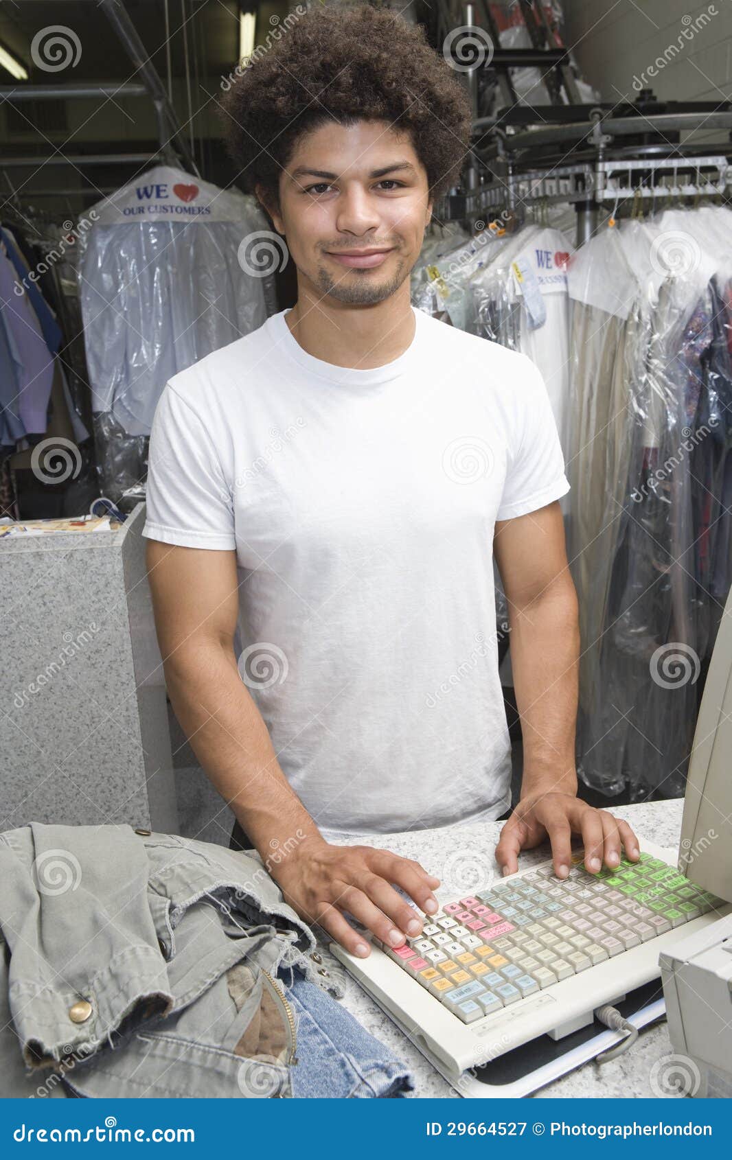 Man Standing at Counter in Dry Cleaning Store Stock Image - Image of ...