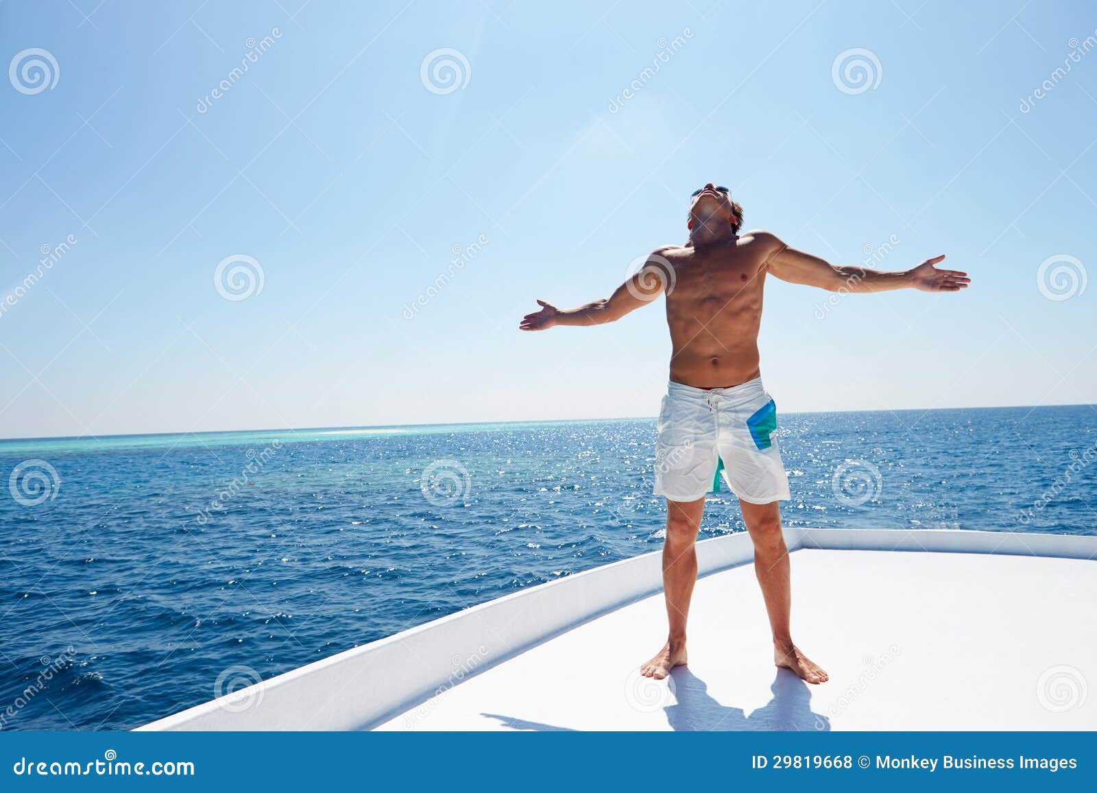 Man Standing on Deck of Boat Stock Photo - Image of tourist, standing ...
