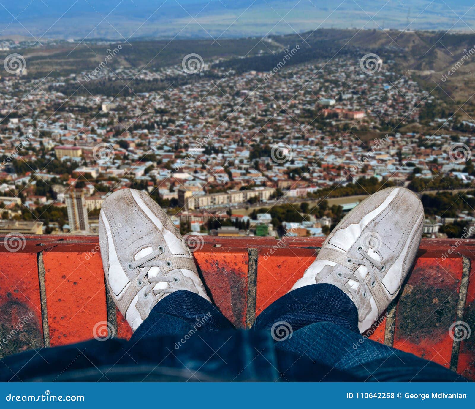 Man standing on edge stock photo. Image of risk, life - 110642258