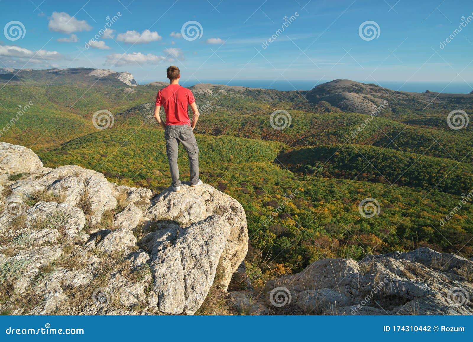 Man Standing on the Edge of Cliff Mountain Stock Photo - Image of ...
