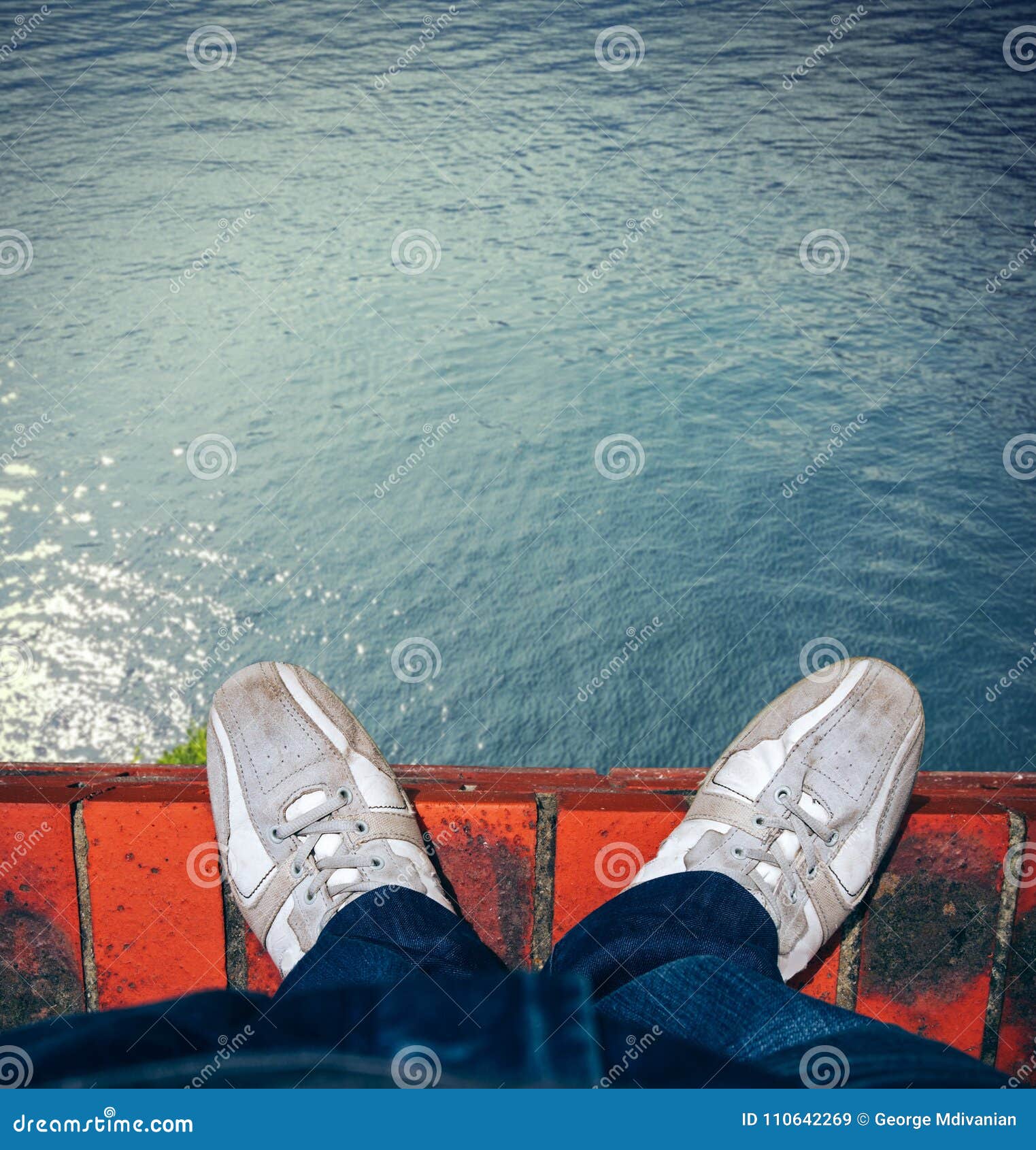 Man standing on edge stock image. Image of building - 110642269