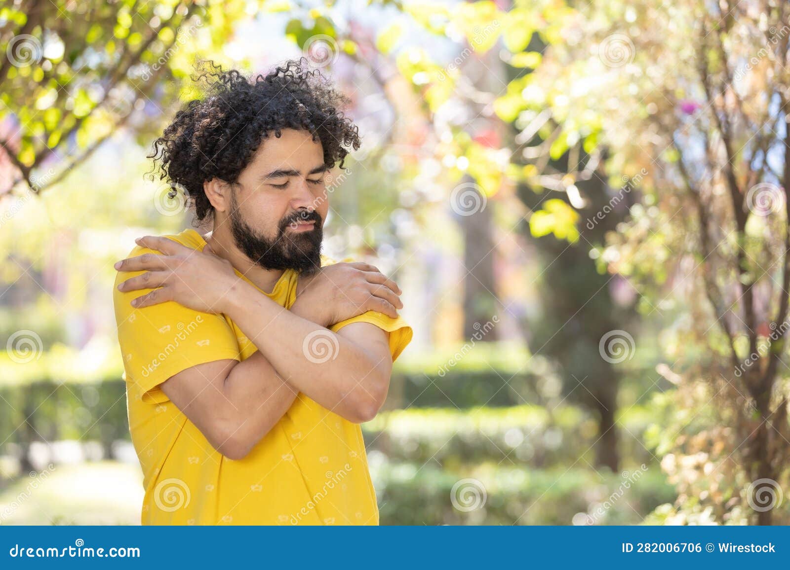 Man Standing in an Embrace Pose Outside at the Park Stock Photo - Image ...