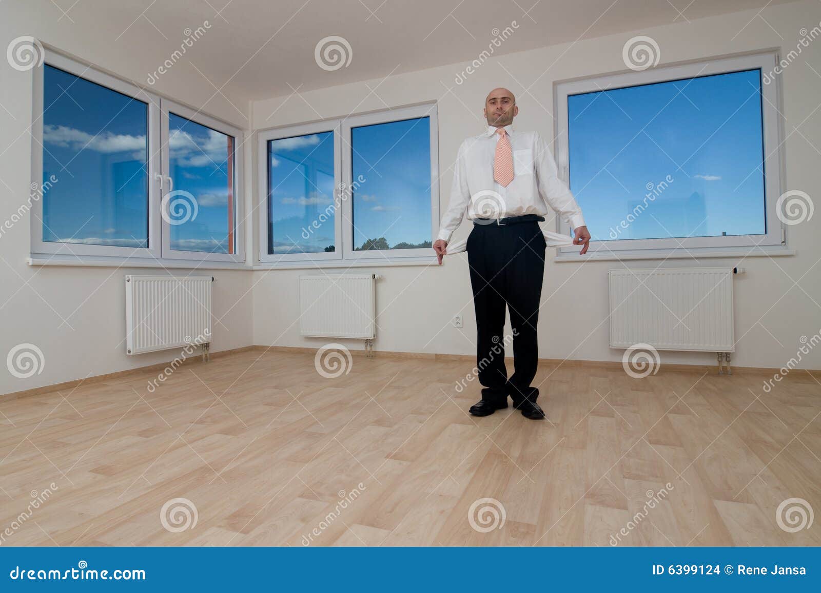 Man standing in empty room stock photo. Image of house - 6399124