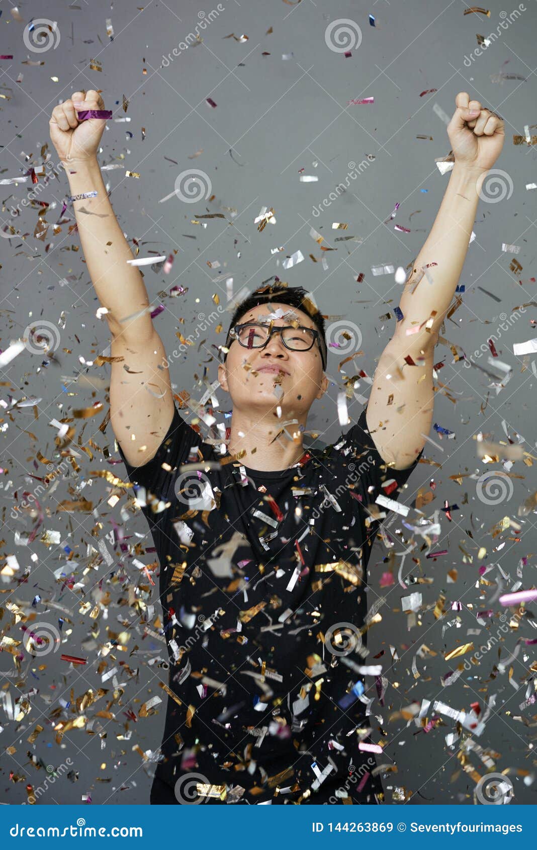 Man Standing in Falling Confetti Stock Image - Image of young ...