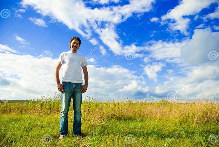 Man standing in a field stock image. Image of landscape - 20964177