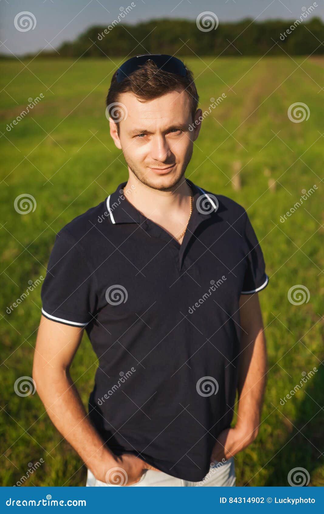 Man Standing in a Field on the Grass Stock Photo - Image of caucasian ...