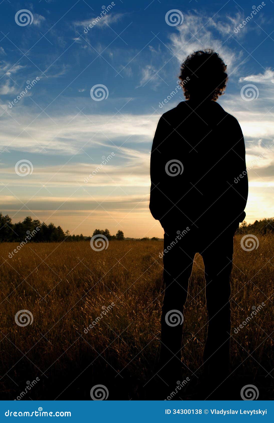 Man standing in field stock photo. Image of hands, quiet - 34300138